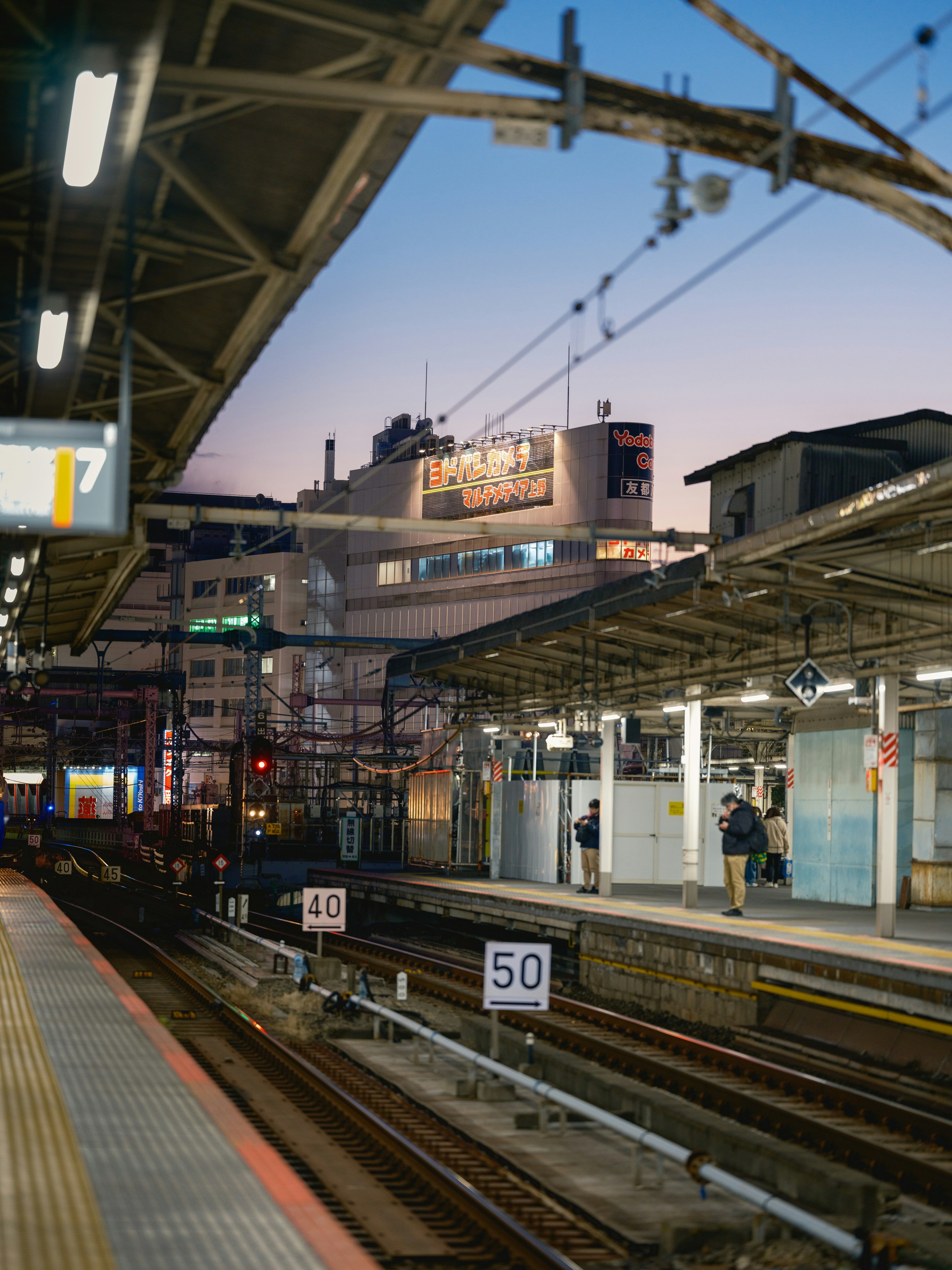 A train station with a train on the tracks photo – Free Sunset Image on ...