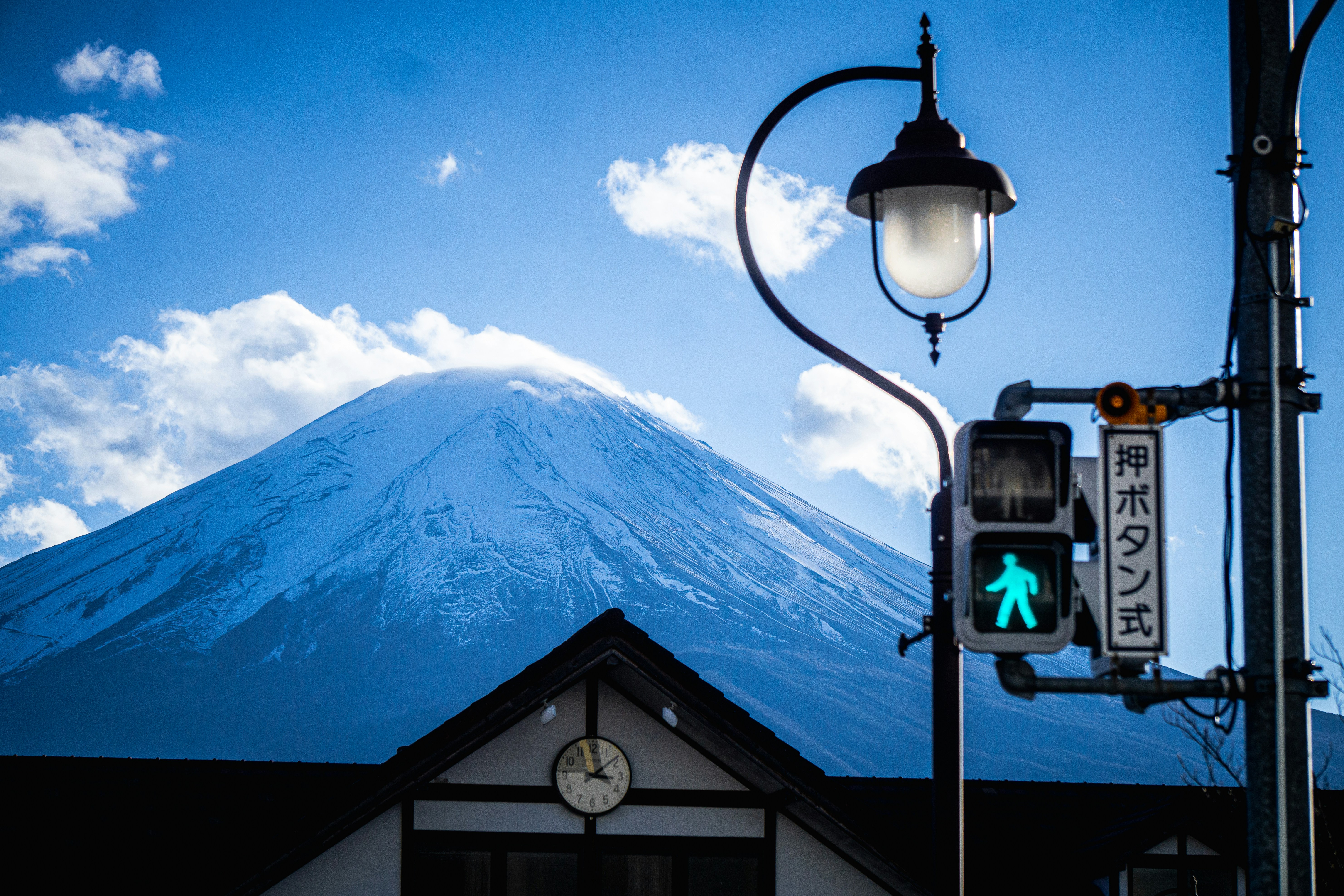 Summit in the Skyline: Mount Fuji Framed by a Street Corner