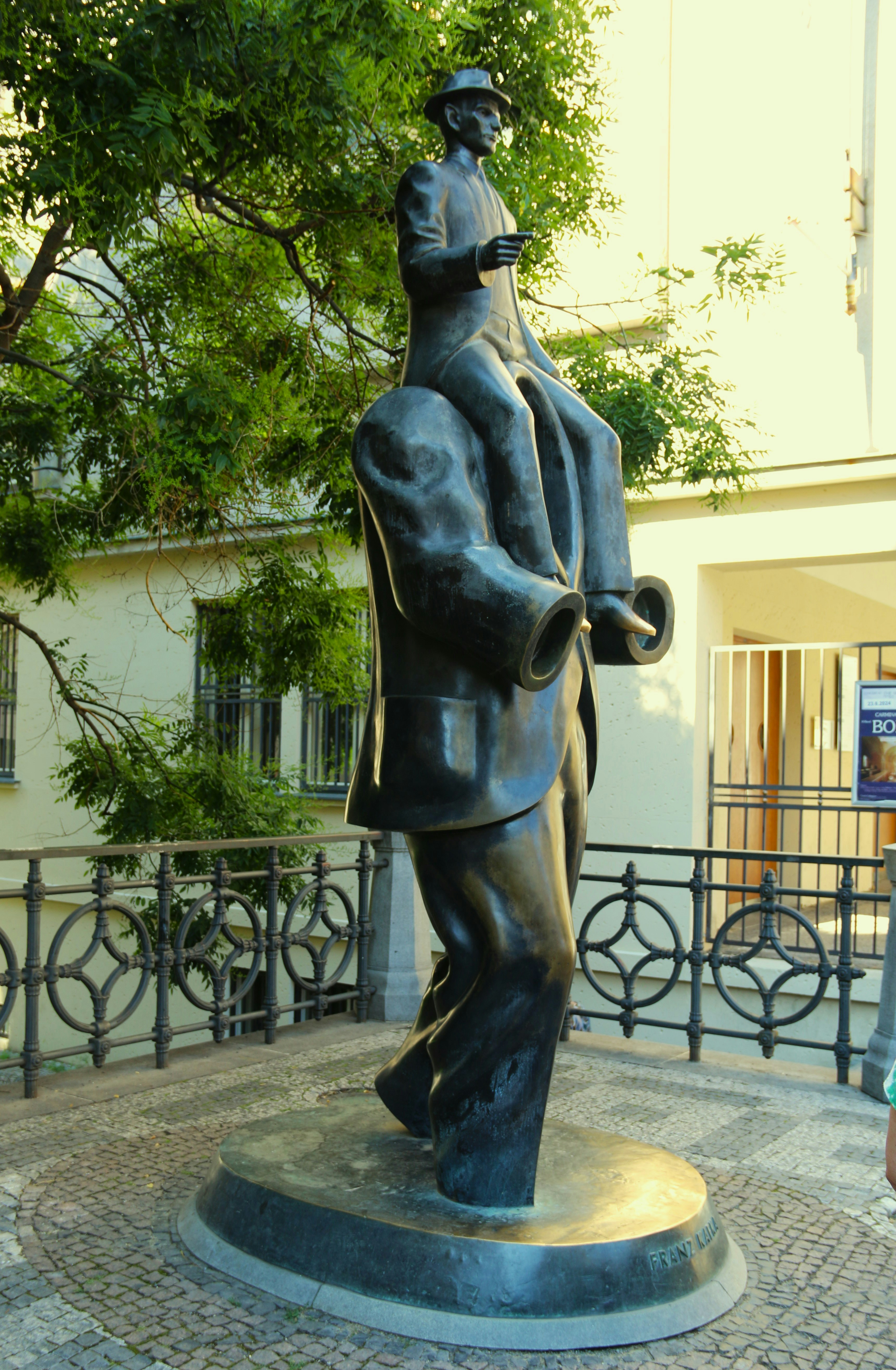 A statue of Franz Kafka (Czech: Socha Franze Kafky) by artist Jaroslav Róna was installed on Vězeňská street in the Jewish Quarter of Prague, Czech Republic in December 2003. It is situated near the Spanish Synagogue. It depicts Franz Kafka riding on the shoulders of a headless figure, in reference to the author's 1912 story "Description of a Struggle"