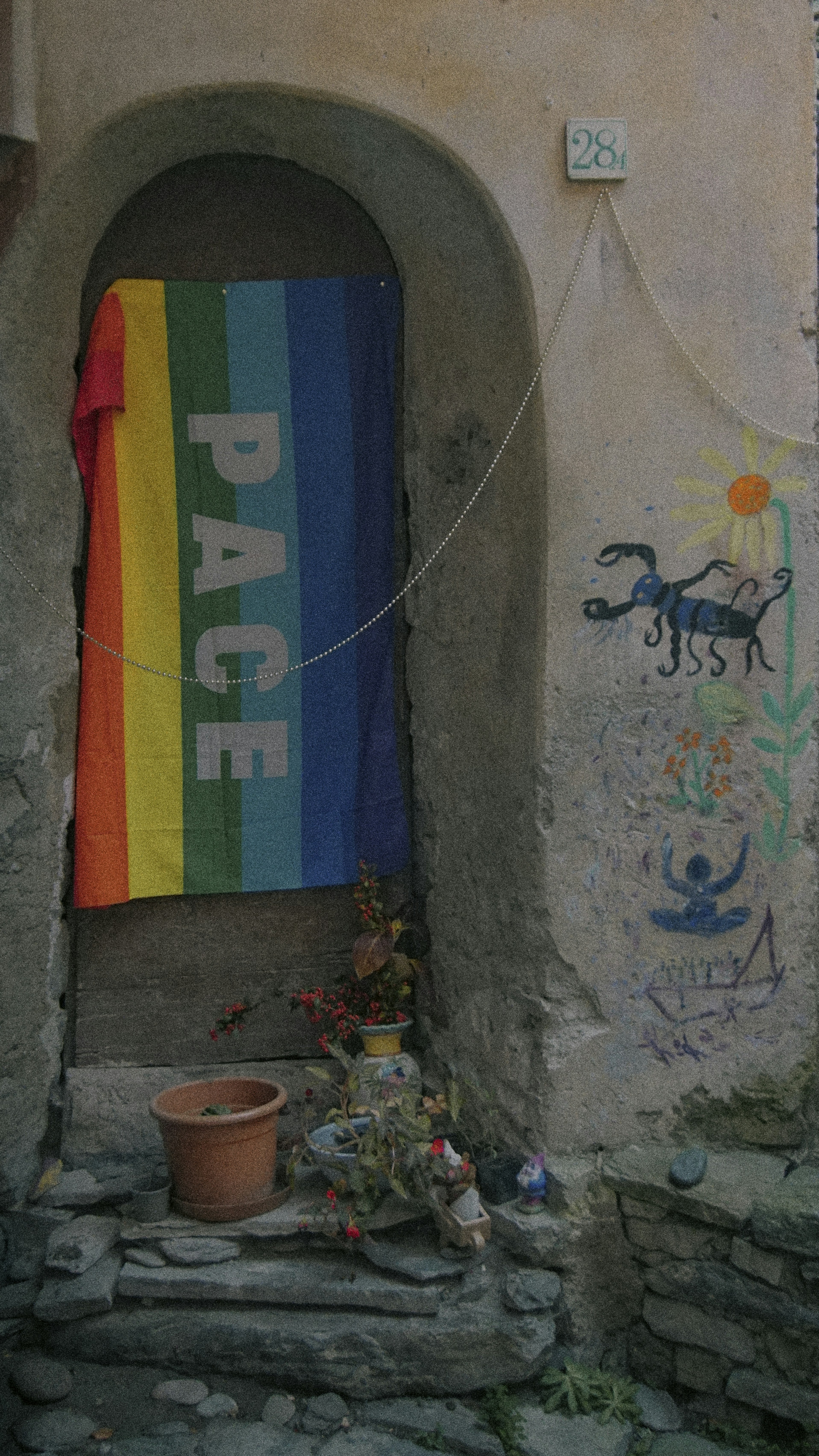 Rainbow Doorway in a Weathered Courtyard