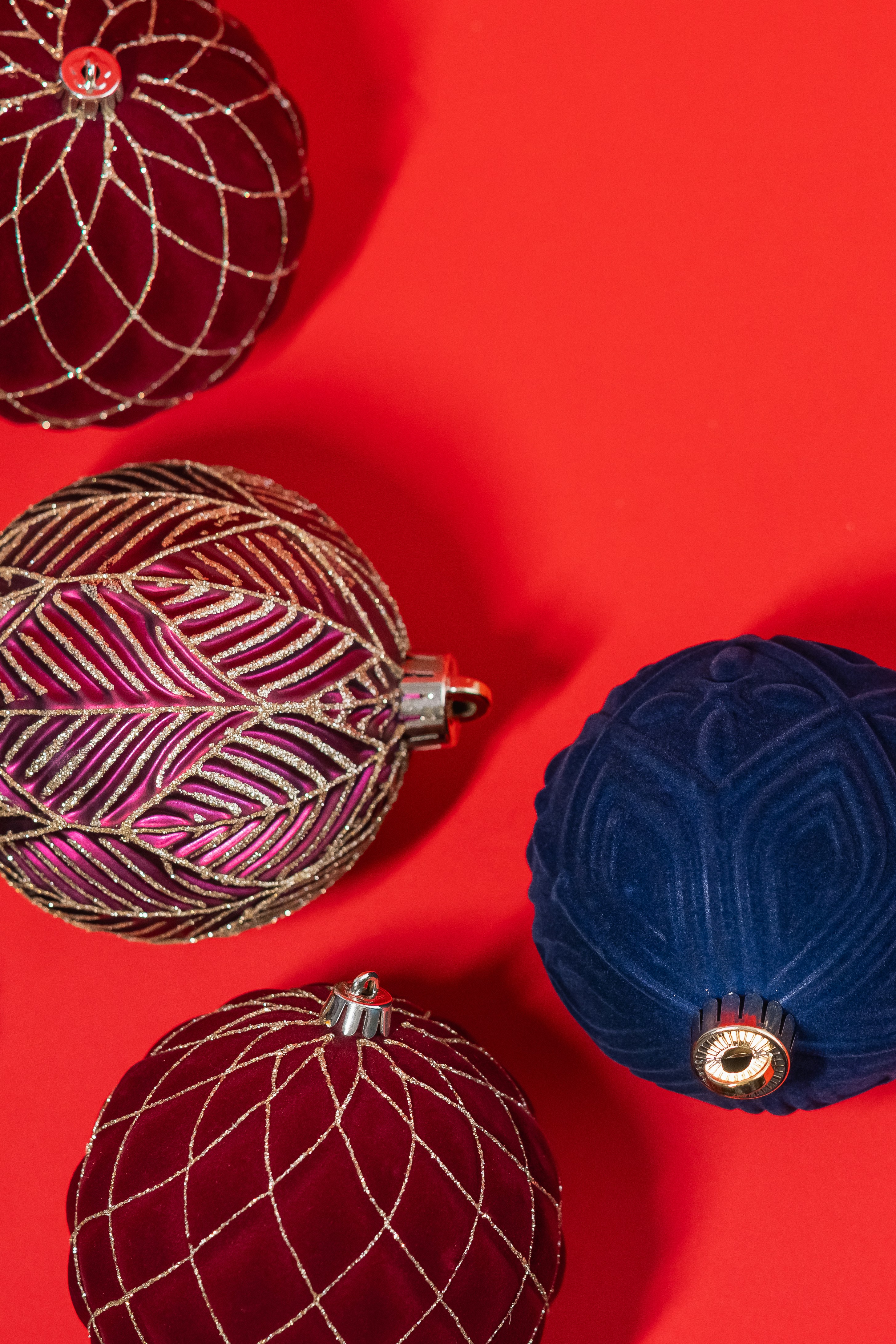 Ornate Christmas Orbs on a Crimson Stage