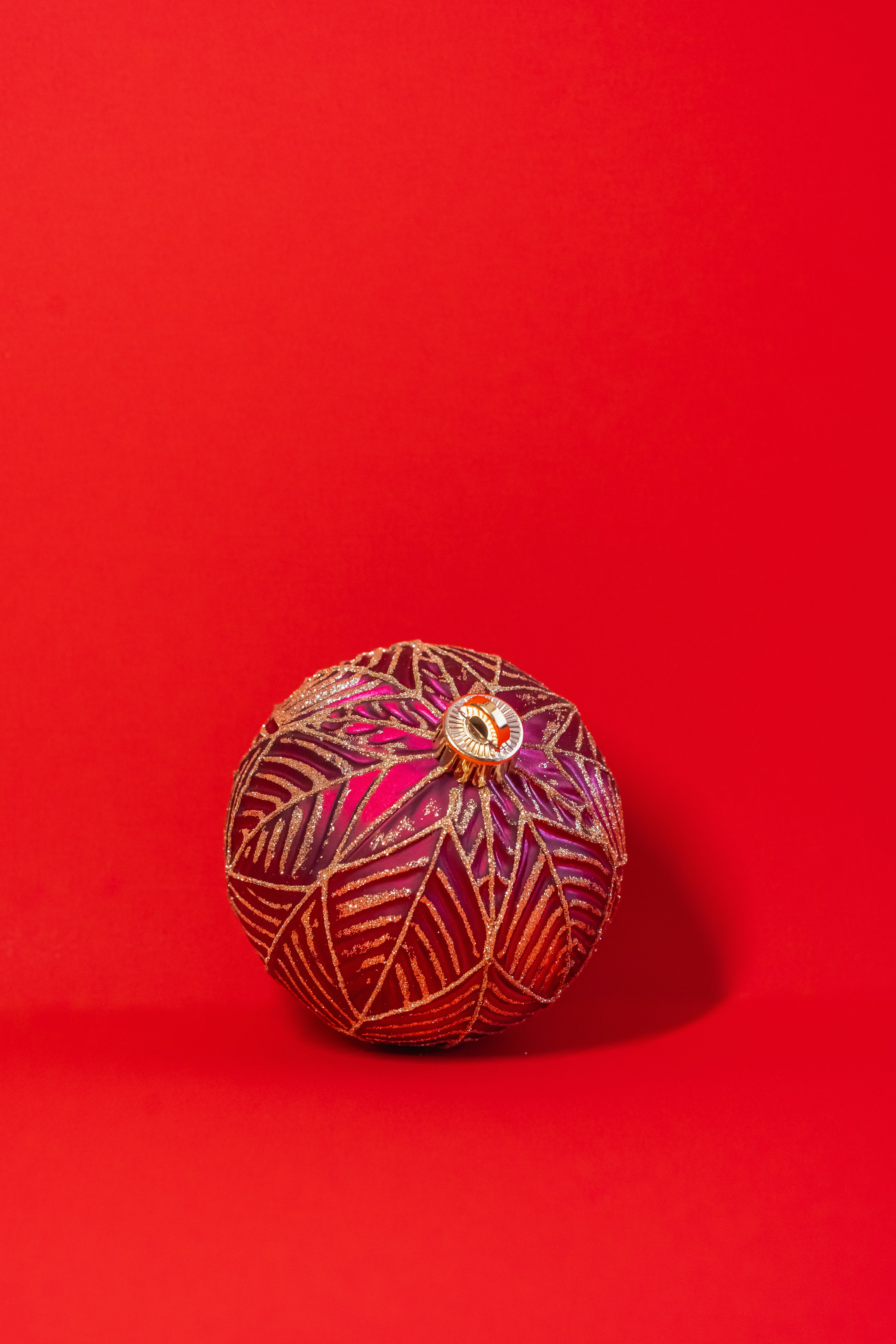 Gilded Leaf Globe on a Scarlet Stage