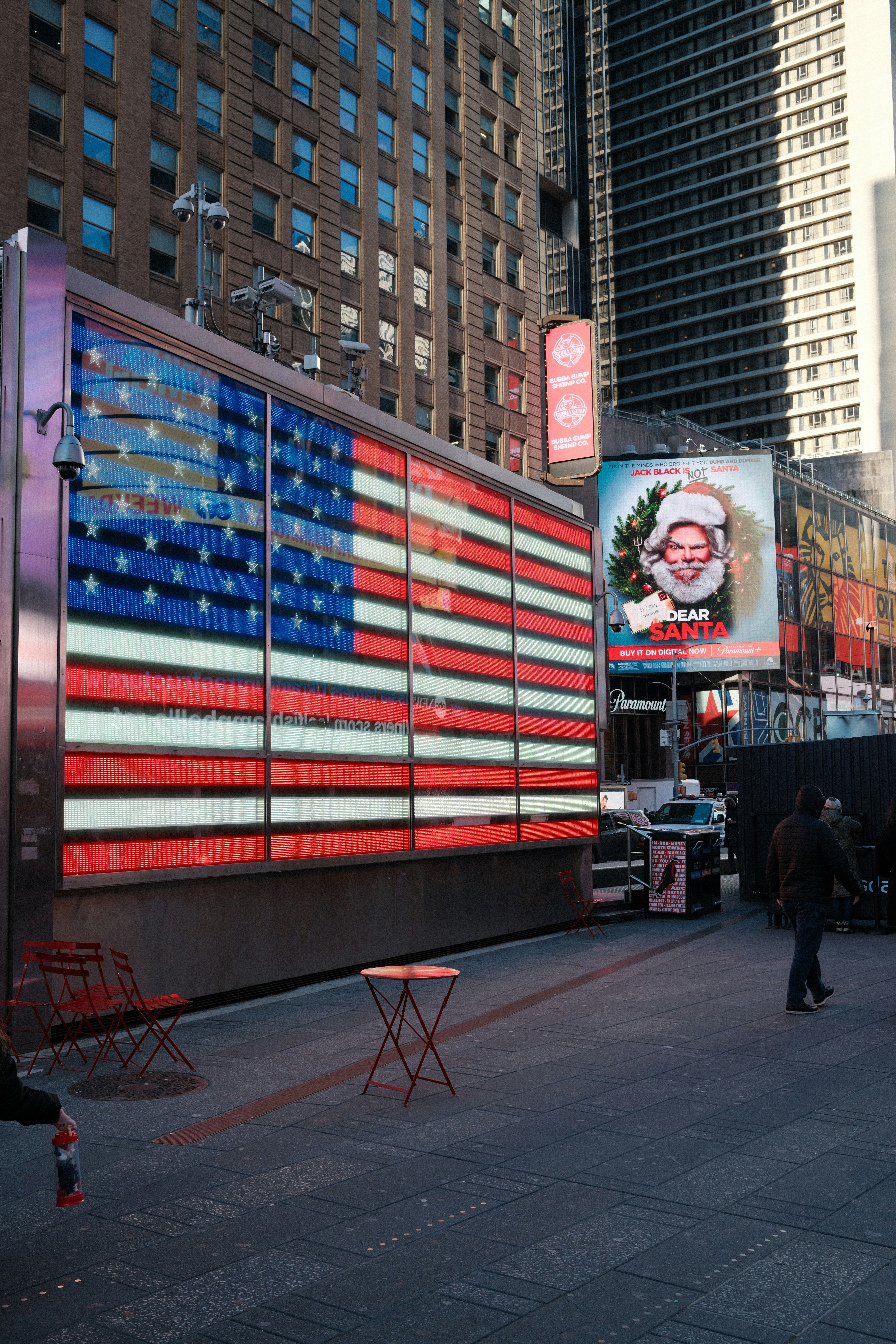 Neon American Flag Panels Illuminate a Bustling Times Square Block