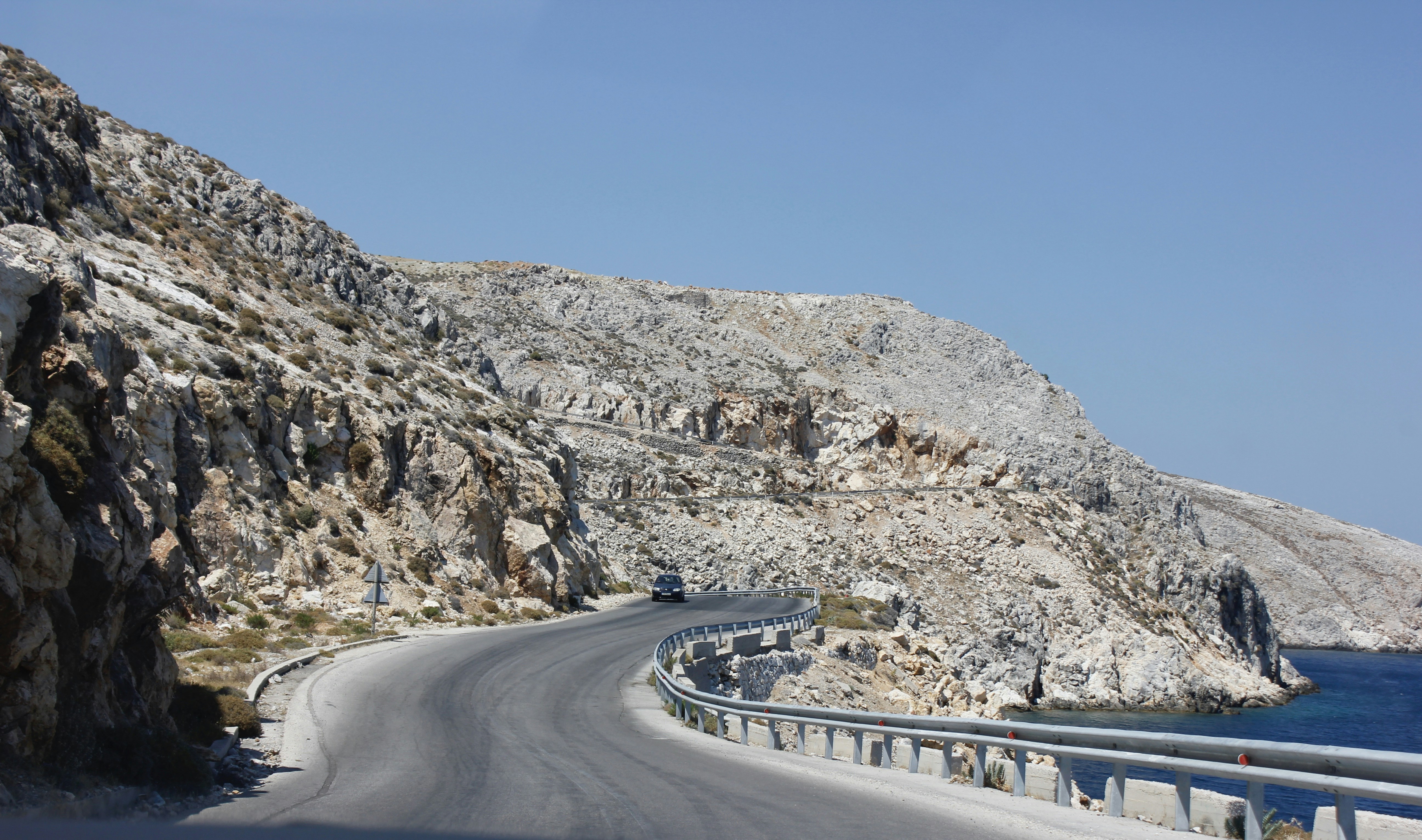 Cliffside Switchback: A Narrow Coastal Road Courting the Sea