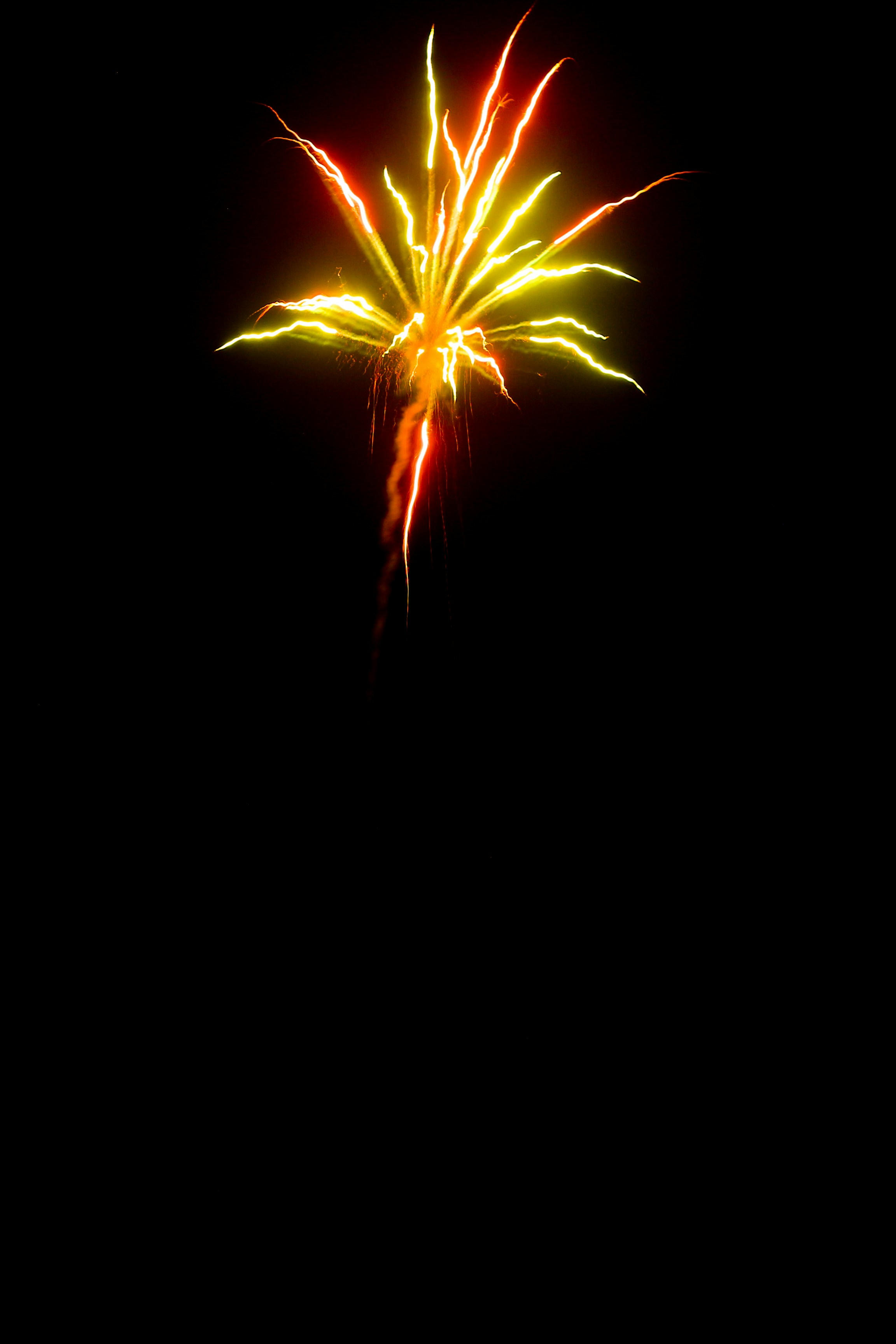 A red and yellow firework on a black background photo – Free Fireworks ...