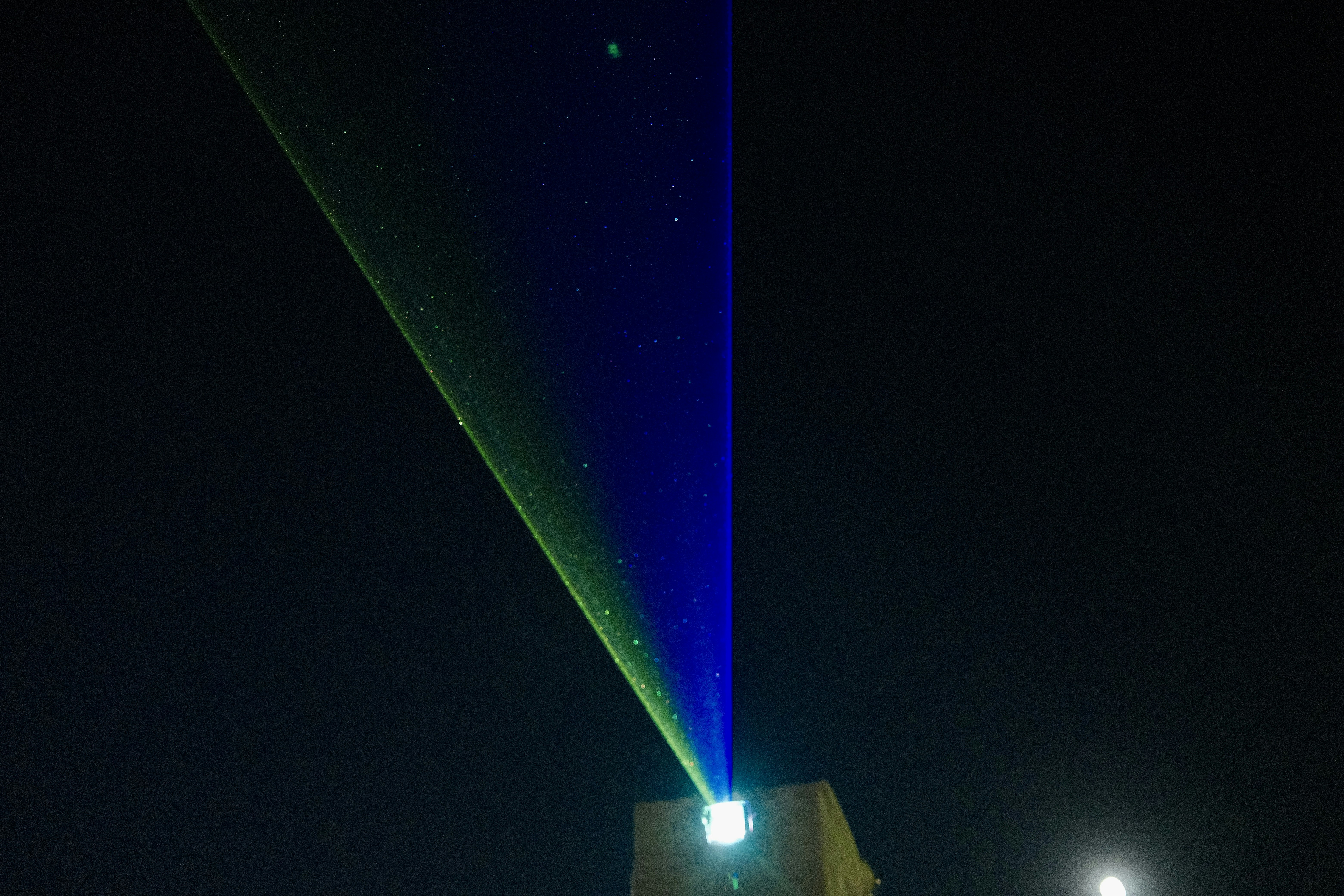 A beam of light is visible in the night sky photo – Free Light Image on ...