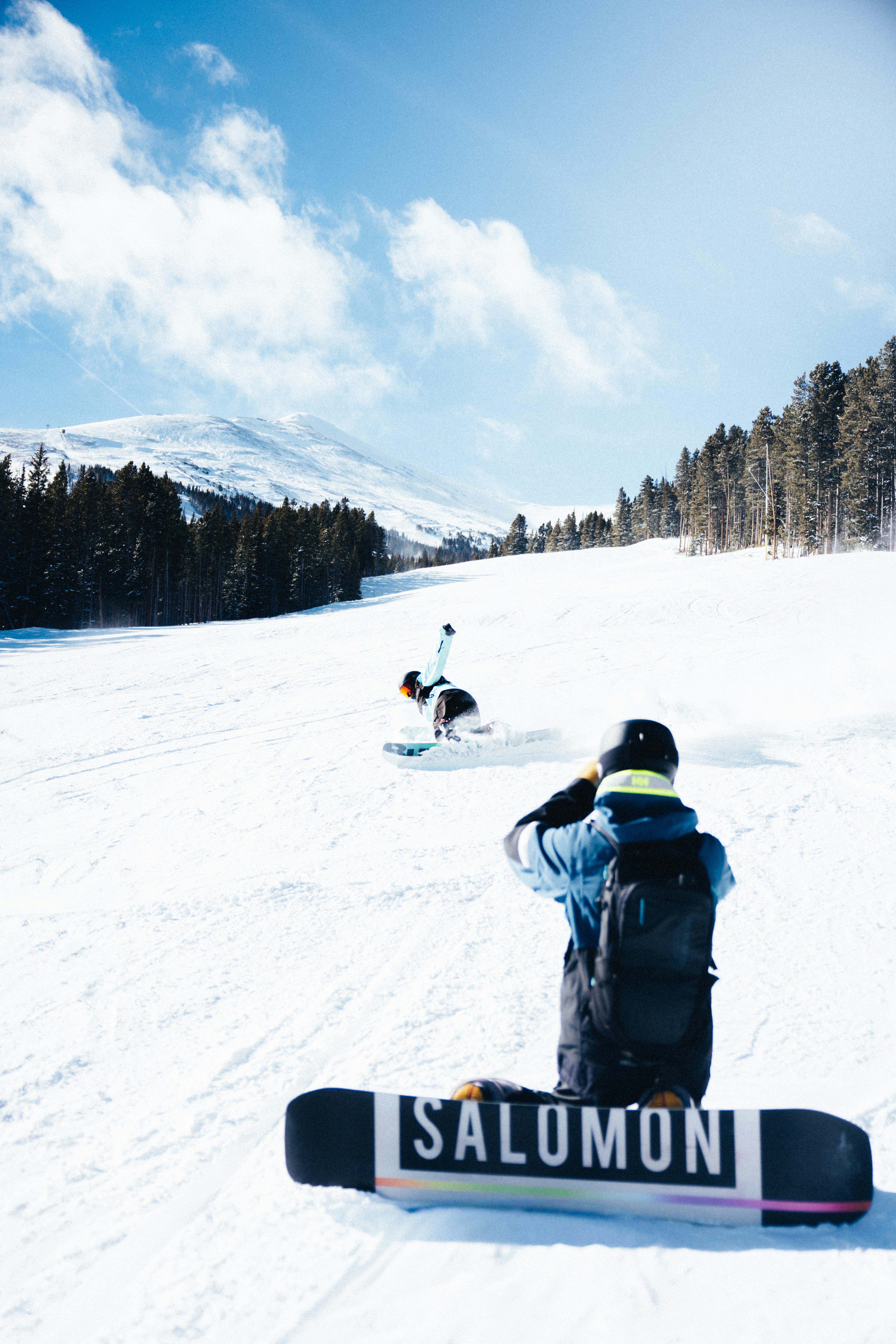 Thrill of the Descent: Snowboarders in Motion