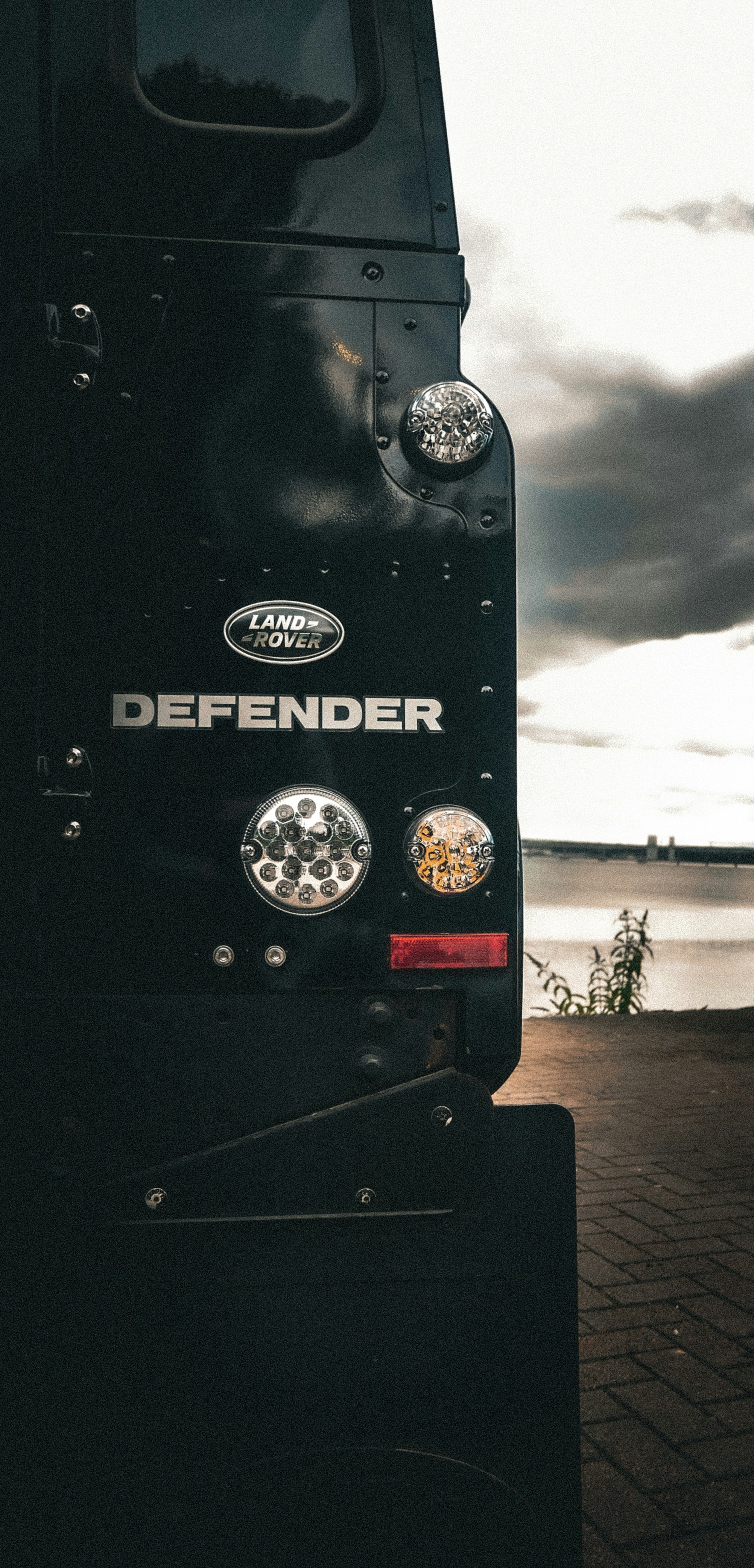 Noir Tailgate: A Land Rover Defender at Twilight