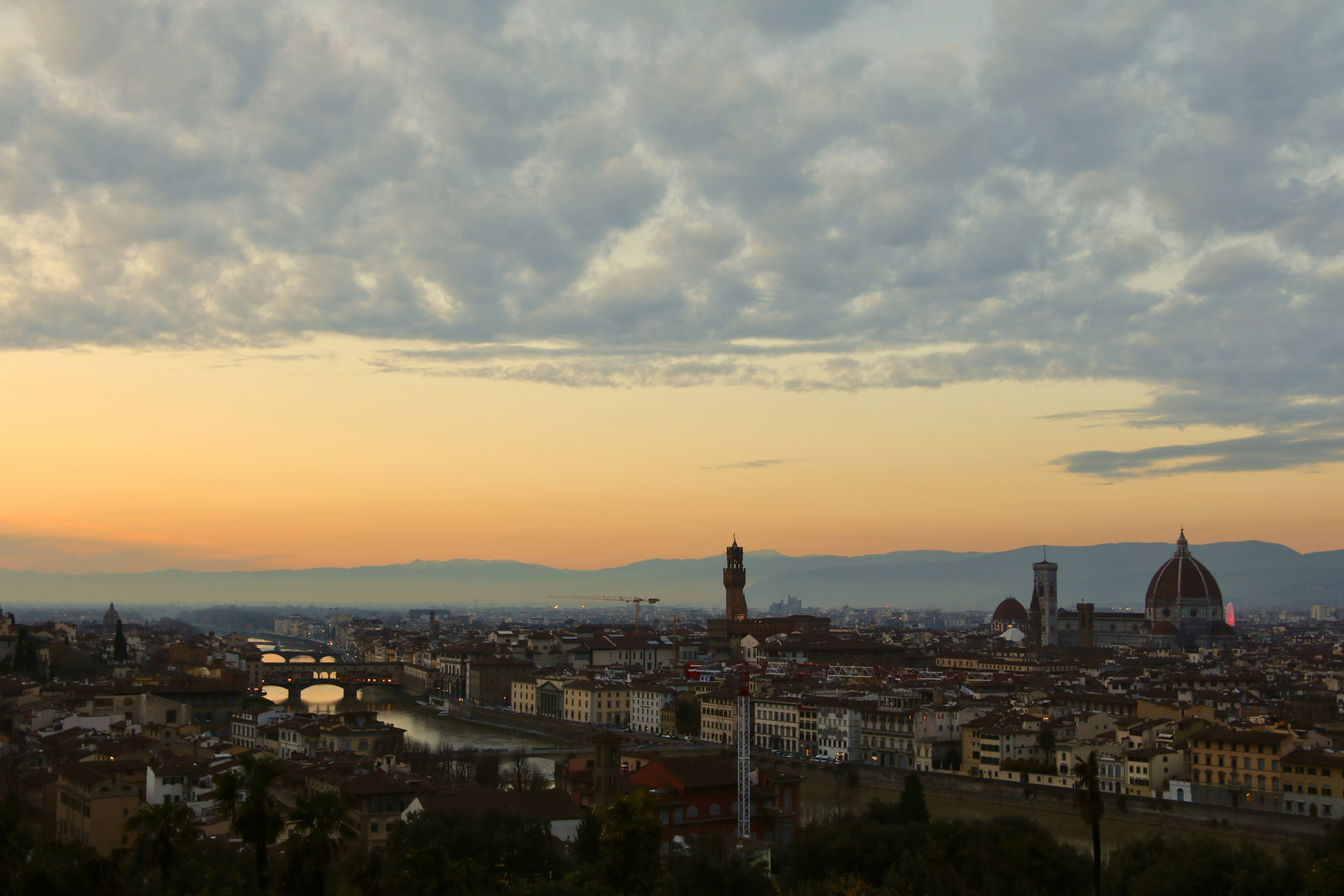 A view of a city at sunset from a hill photo – Free Cloud Image on Unsplash