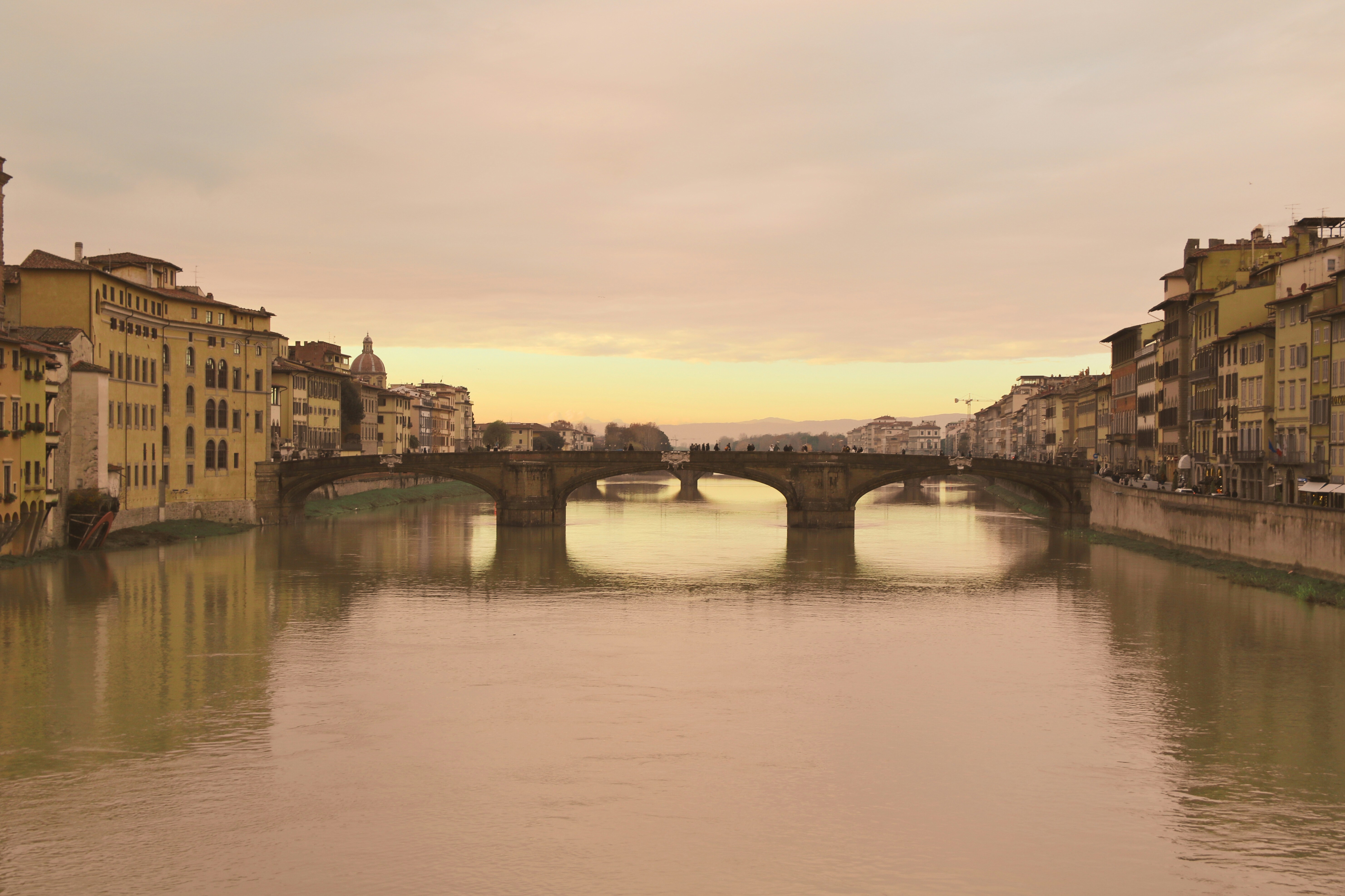 A river running through a city next to tall buildings photo – Free ...