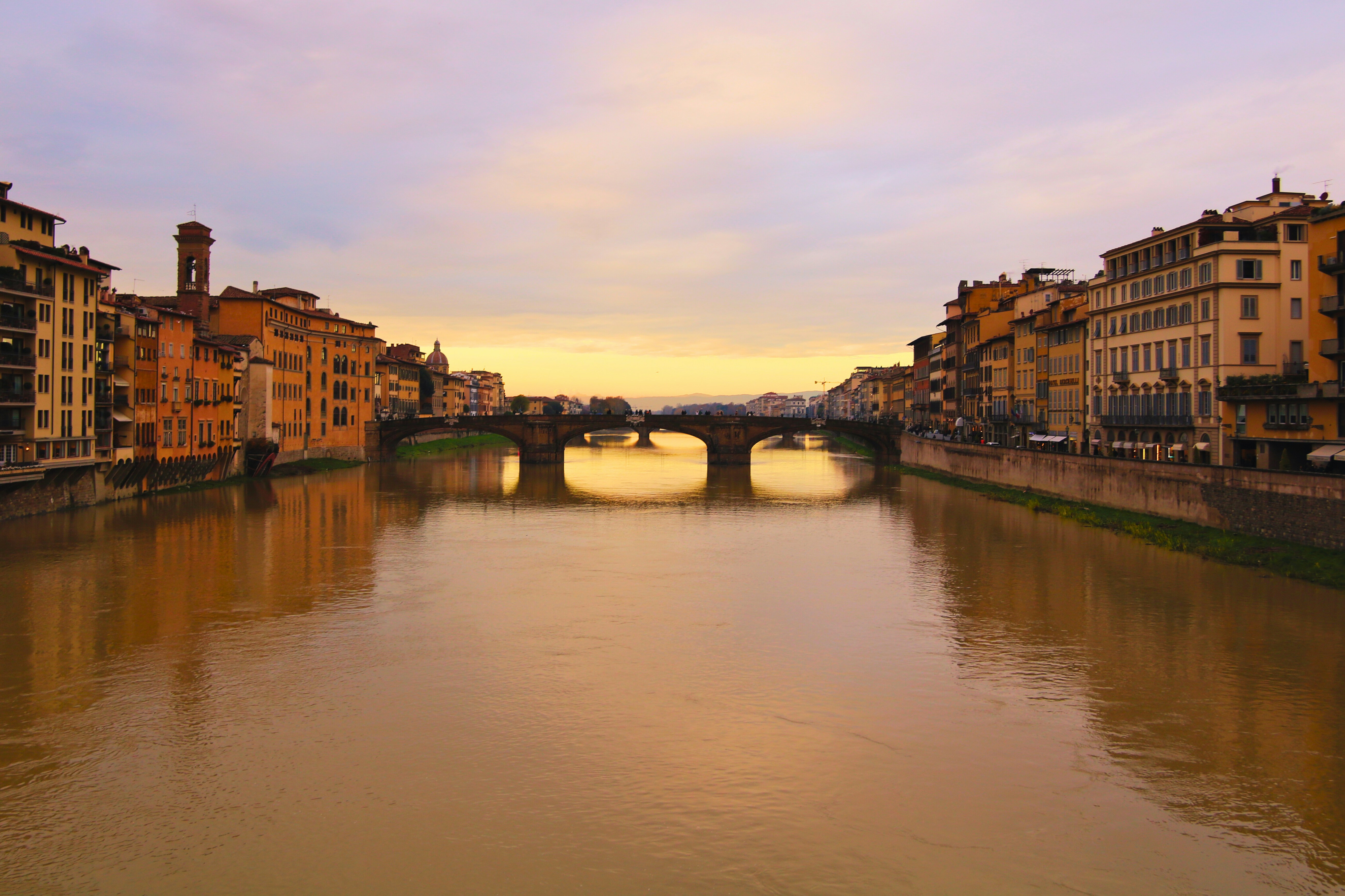 A river running through a city next to tall buildings photo – Free ...