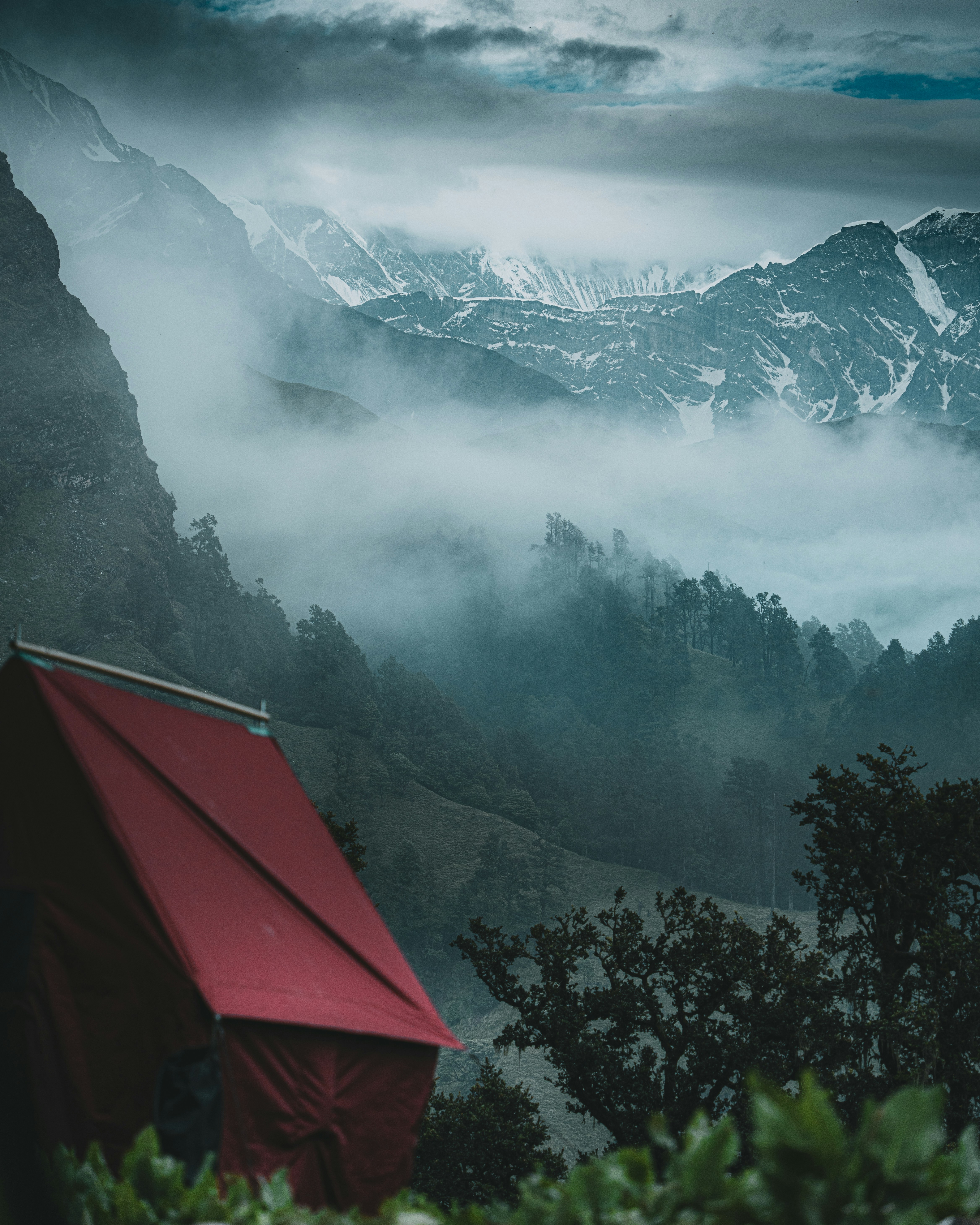 Crimson Tent at the Edge of a Mist-Wrapped Alpine Range