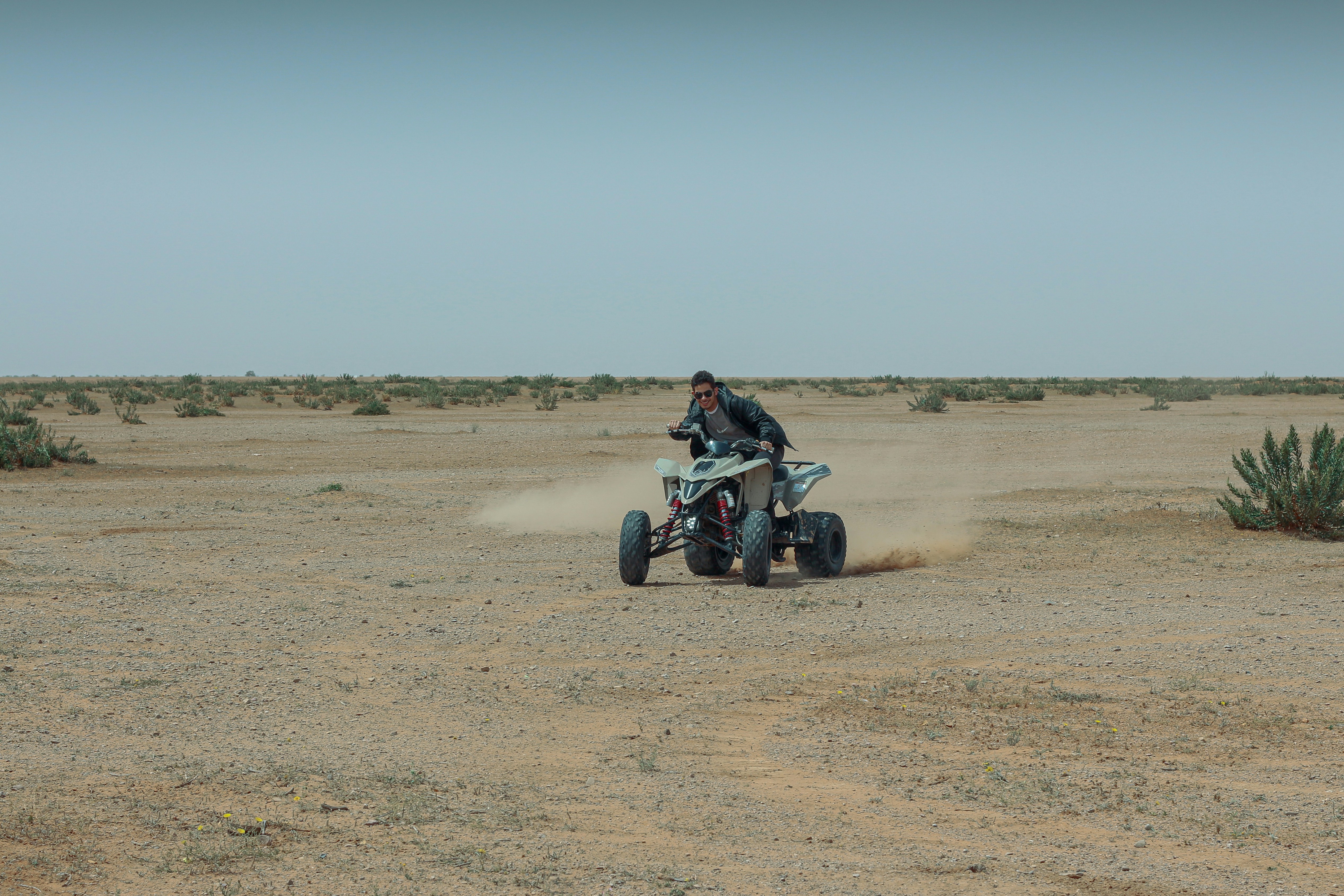 A person riding a four wheeler in the desert photo – Free Riyadh saudi ...