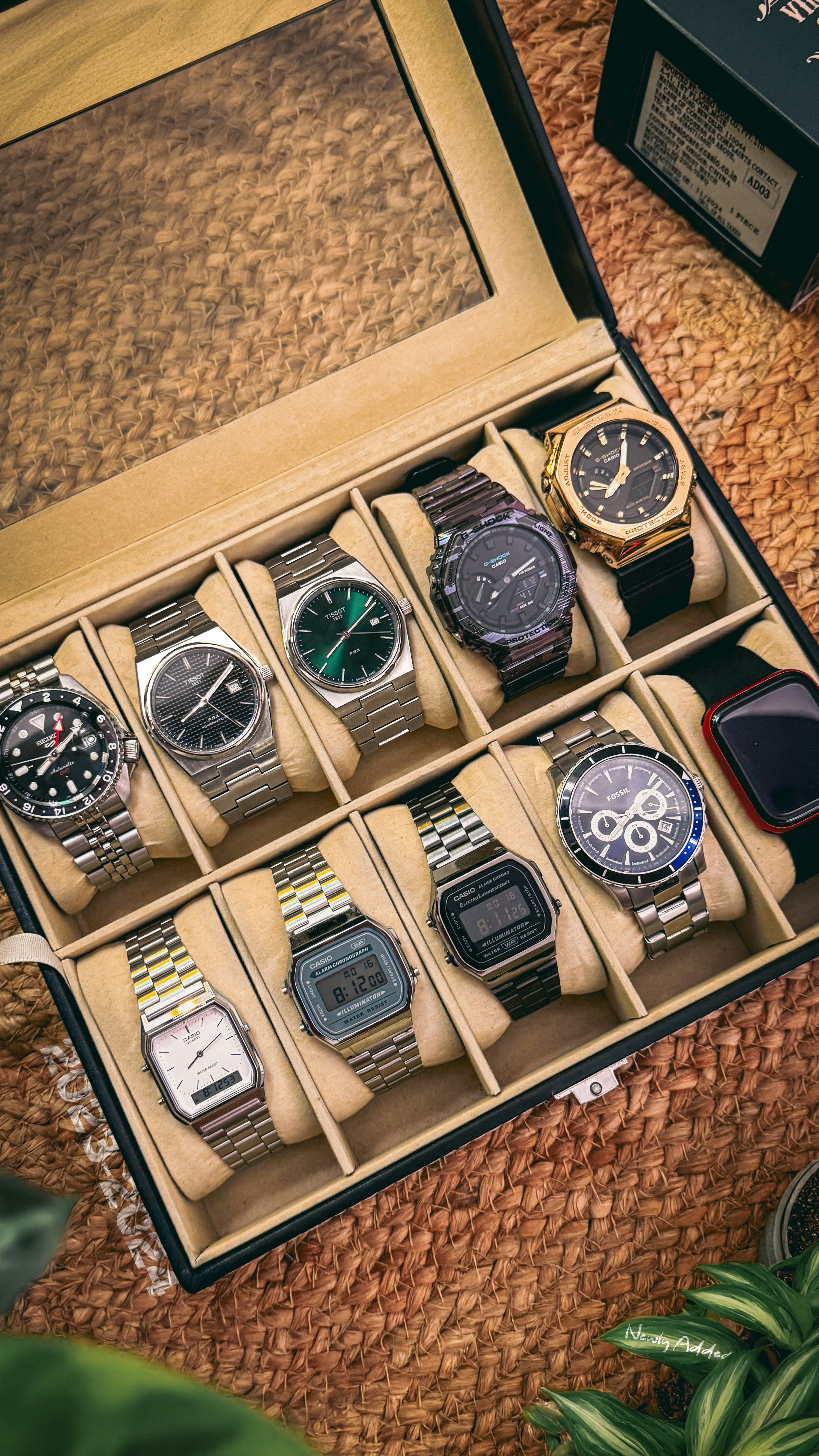 A box of watches sitting on top of a table photo – Free Wristwatch ...