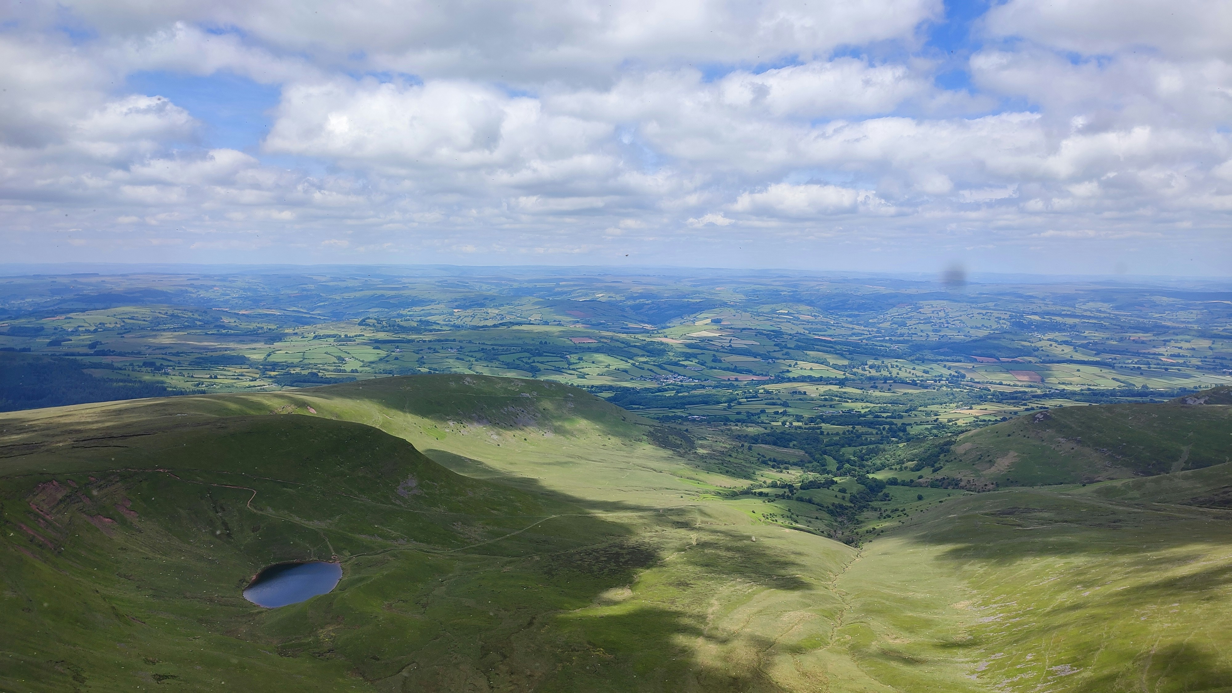 An aerial view of a valley and a lake photo – Free Brecon beacons ...