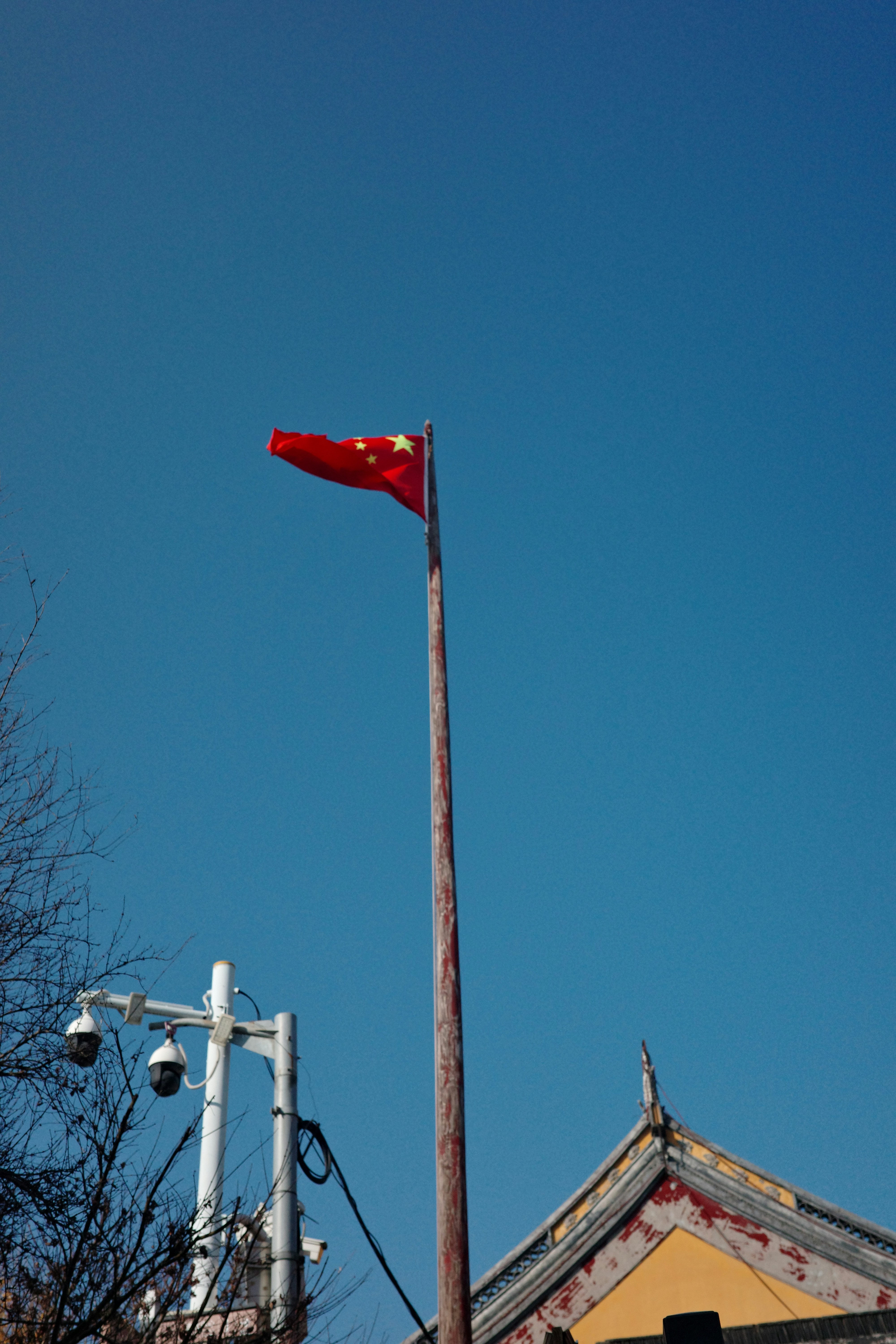 Herald of the Sky: A Flag's Stand Against the Blue