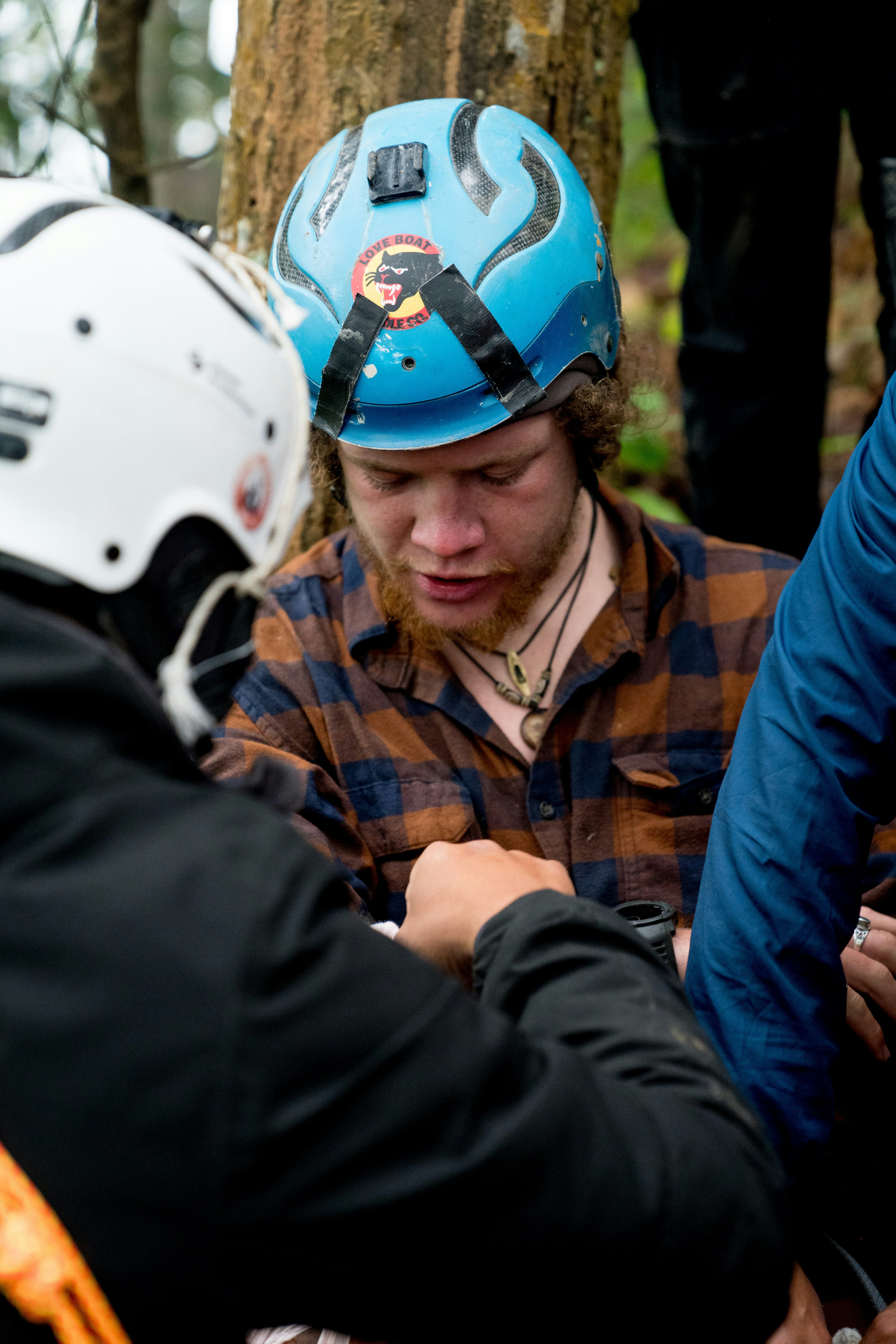 Blue-Helmet Focus in the Woods: A Moment of Teamwork