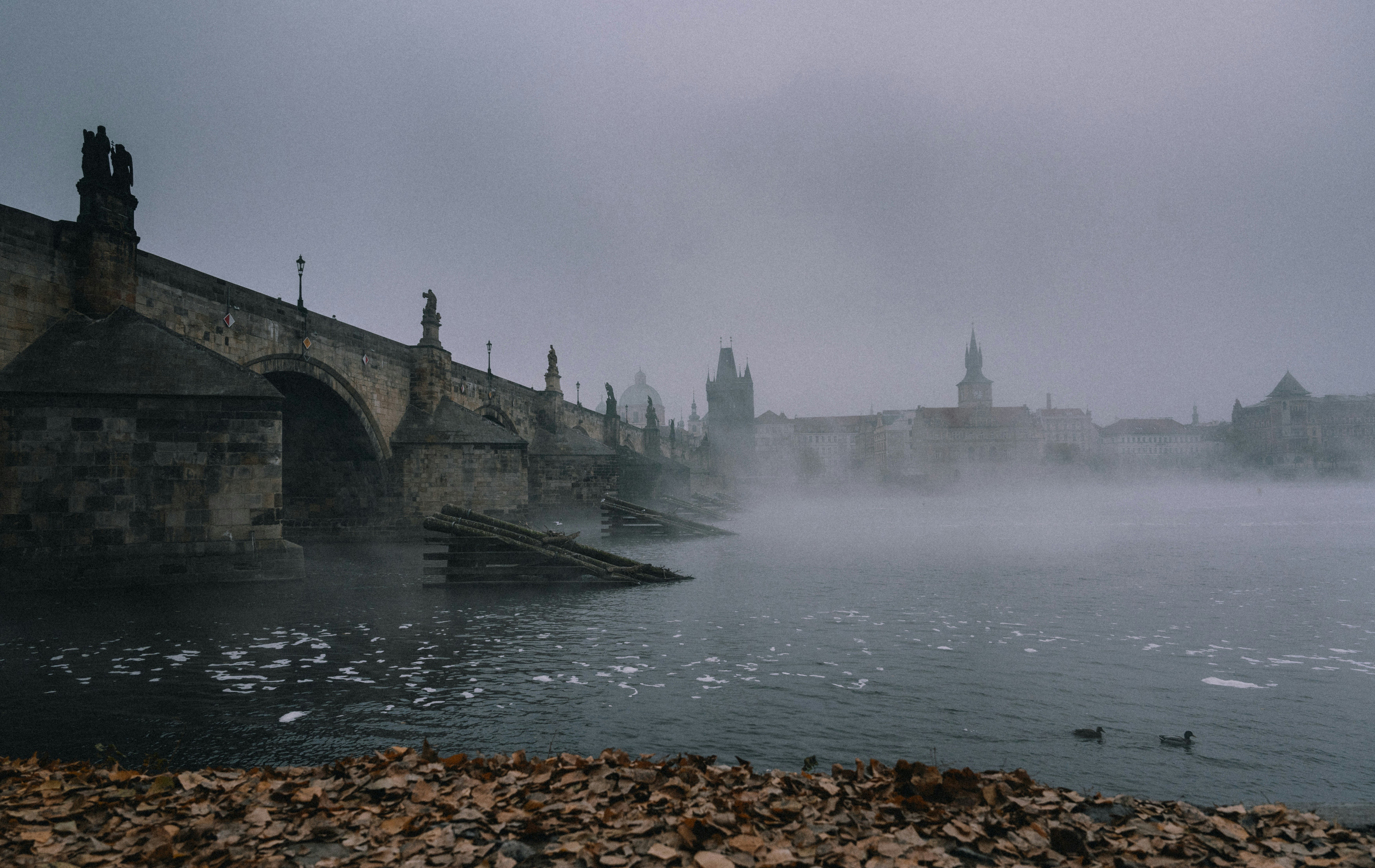 Mist-Wreathed Charles Bridge: Fog Drifts Over the Vltava