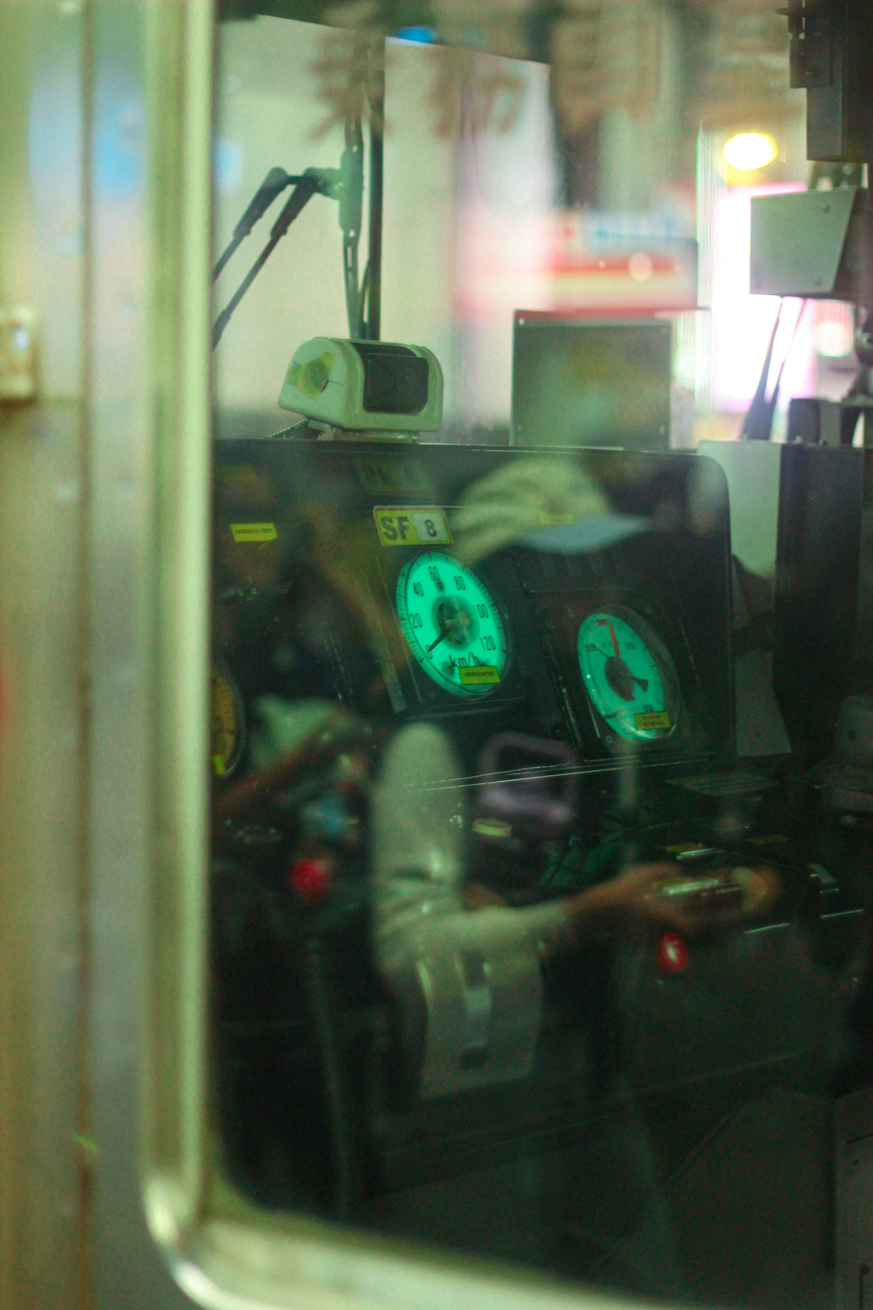 Green Gauge Glow Through a Glass Portal