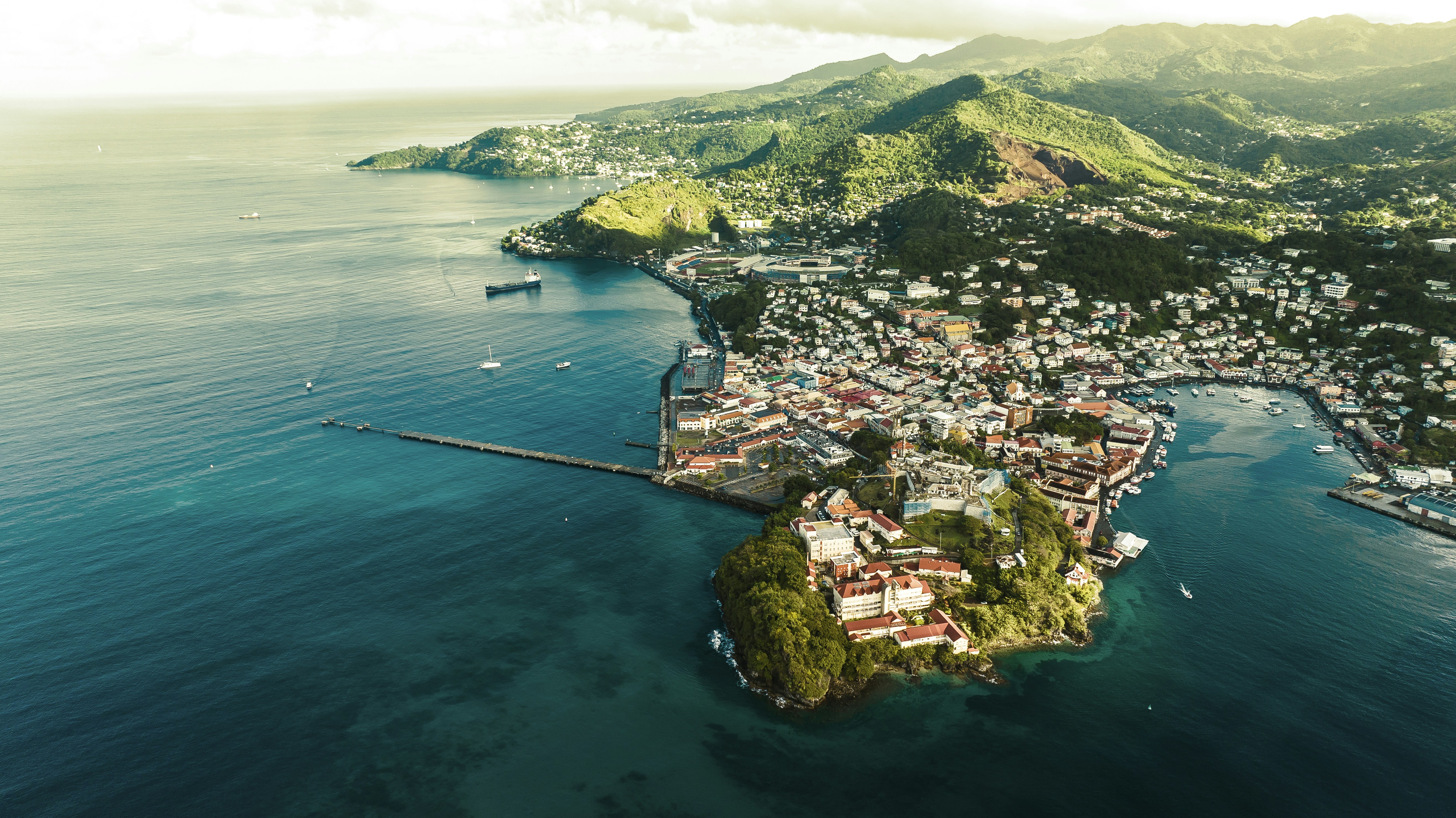 An aerial view of a small island in the middle of the ocean photo ...