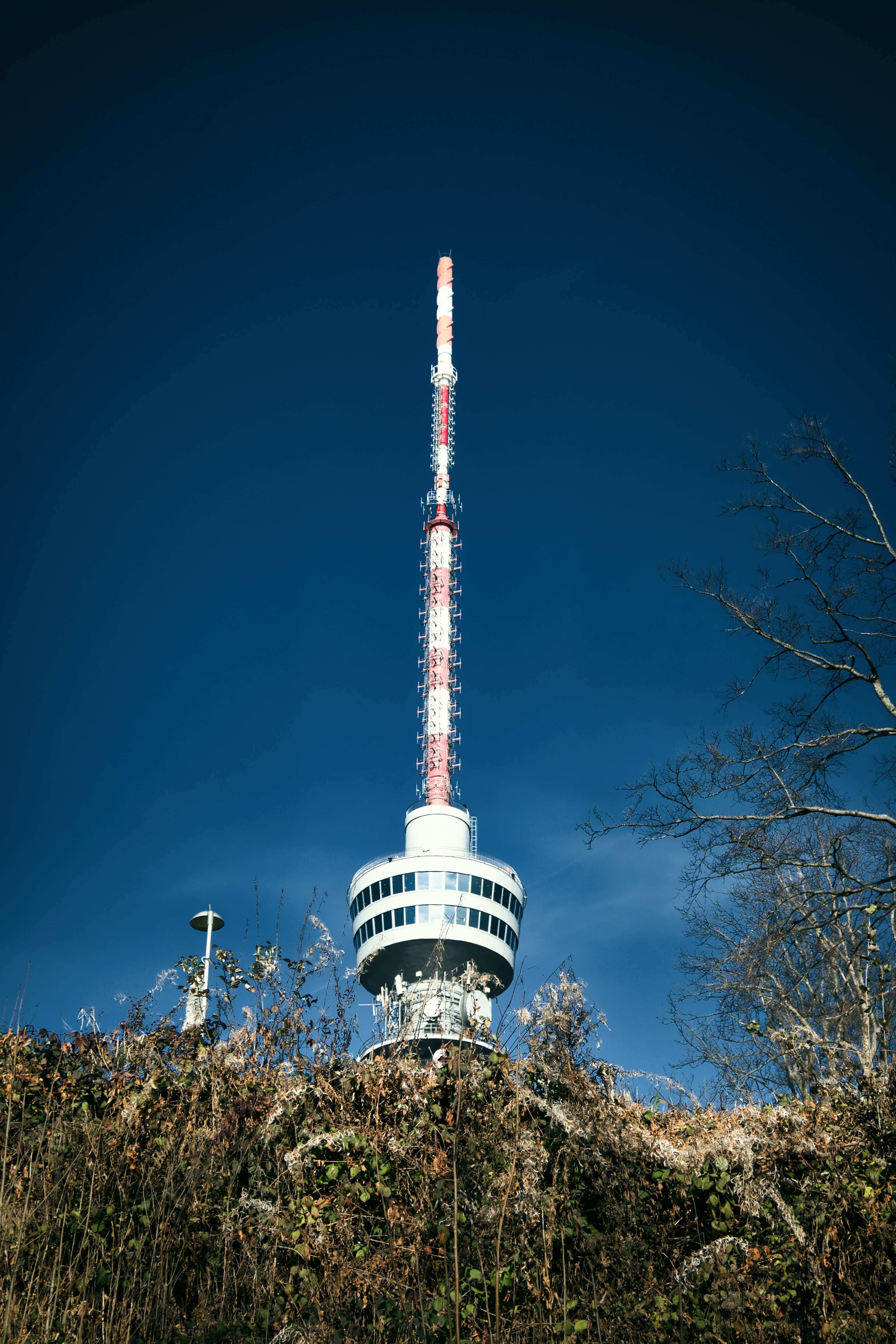 A very tall tower sitting on top of a hill photo – Free Tower Image on ...
