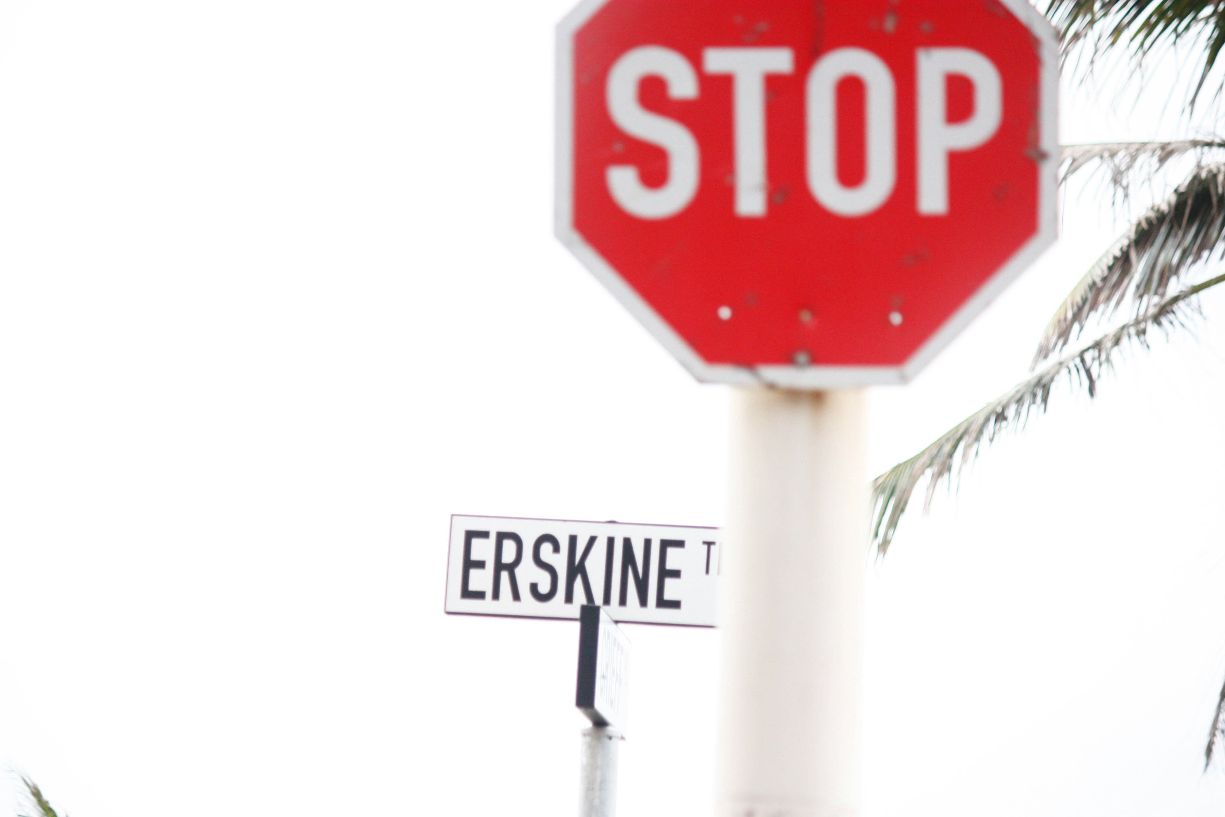 A red stop sign sitting on the side of a road photo – Free Sign Image ...