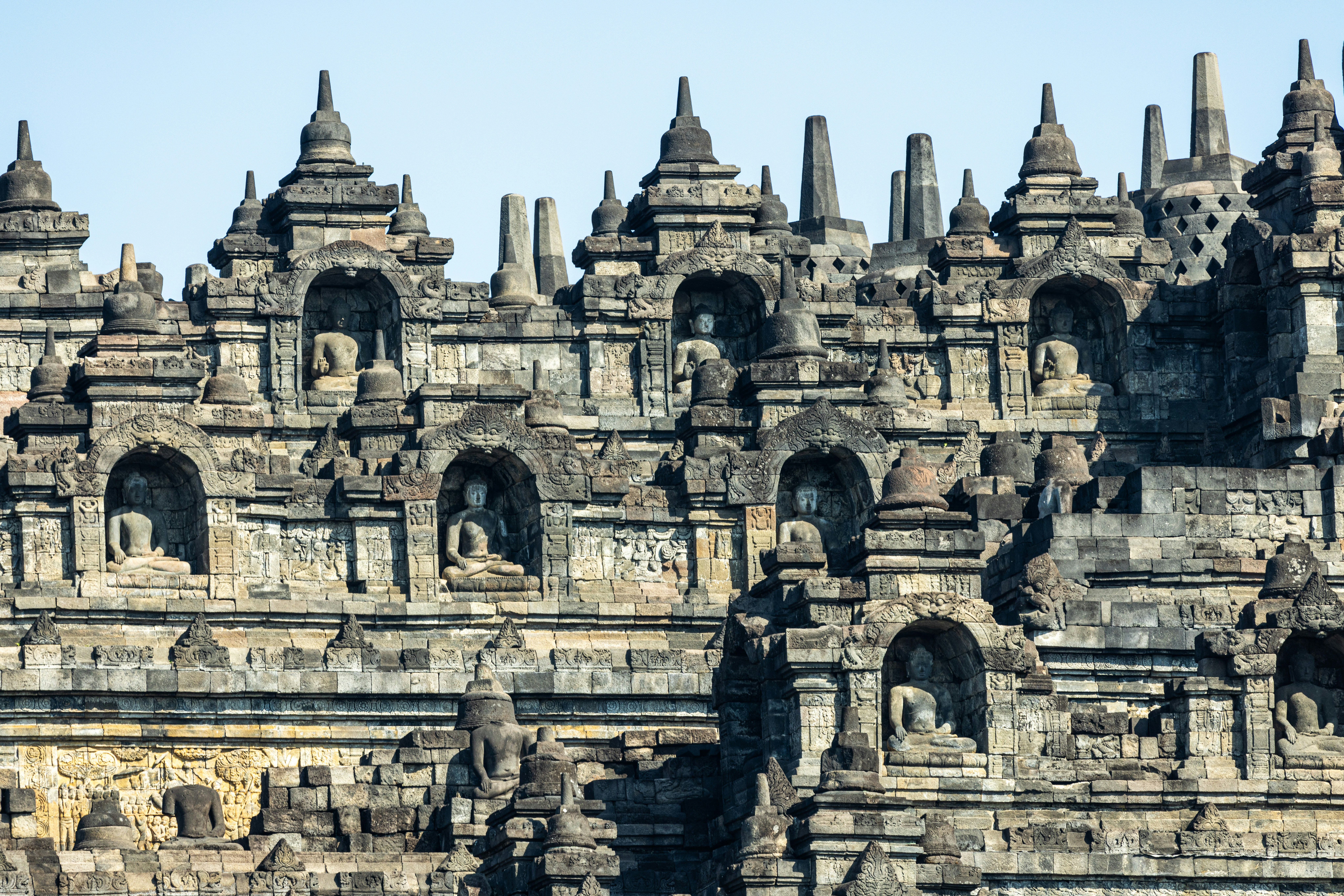 A large group of stone structures with a sky background photo – Free ...