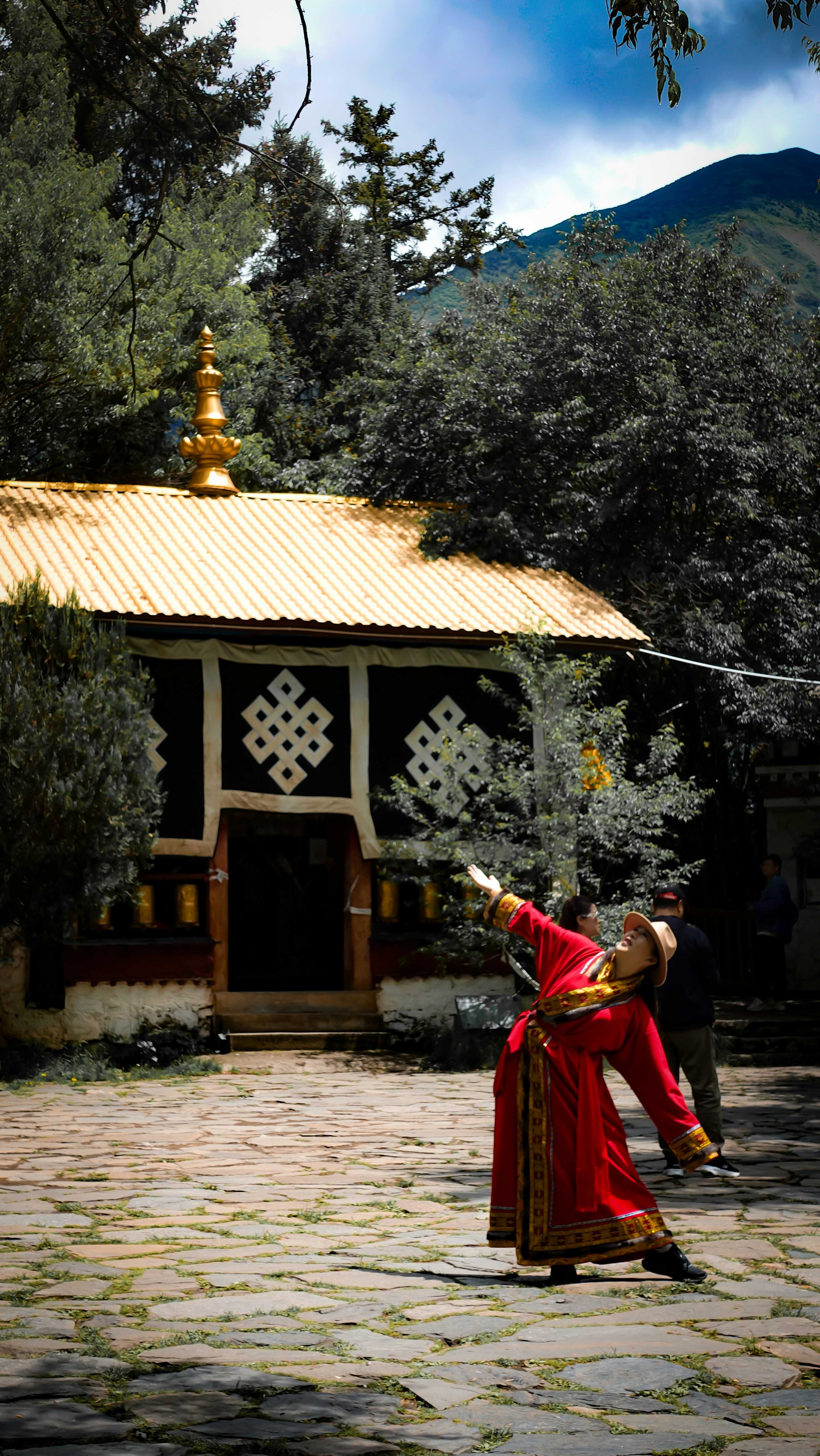 Dancer in Red Enchants the Courtyard of a Golden-roofed Shrine