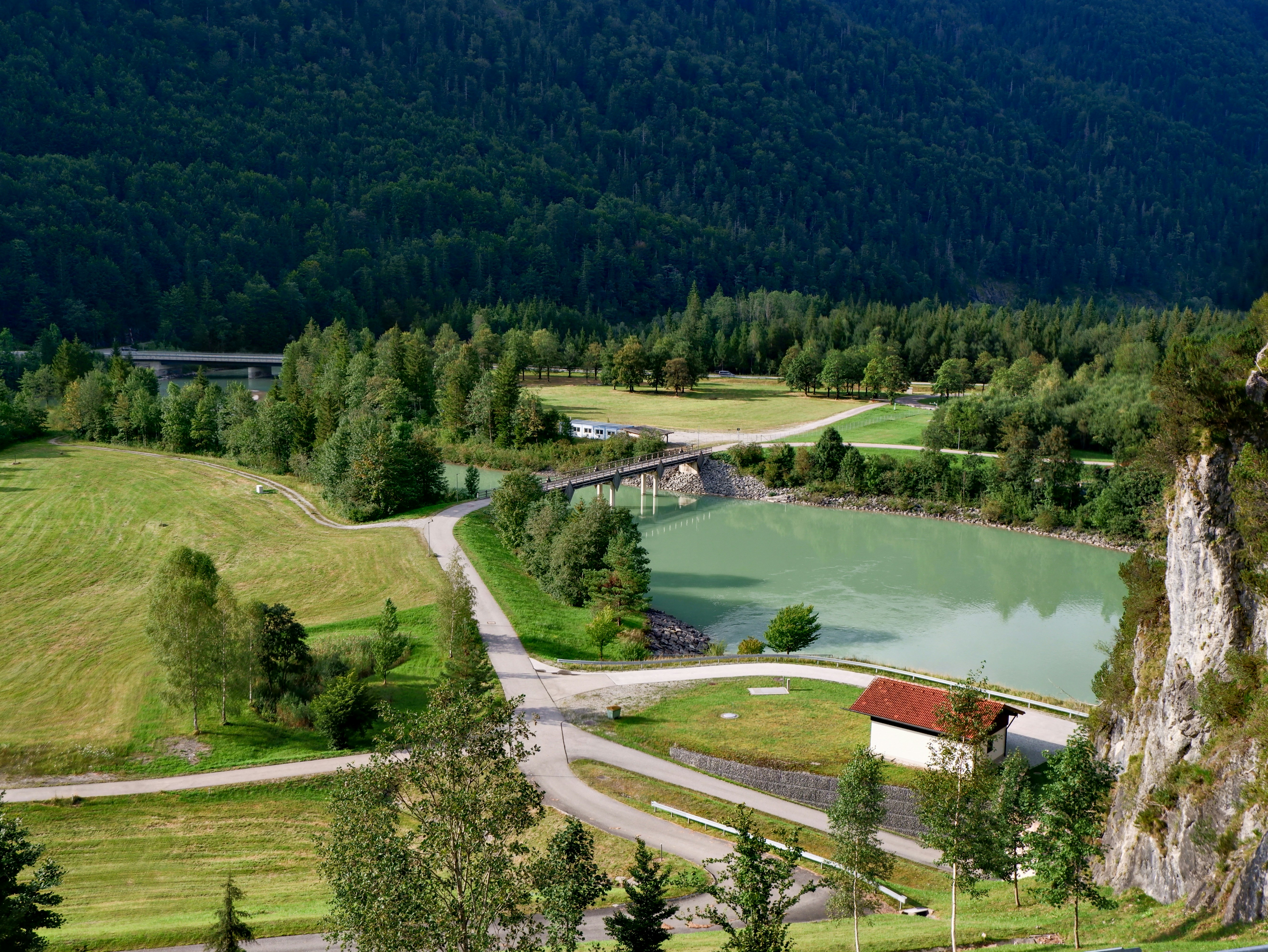 Serpentine Roads and Alpine Reflections