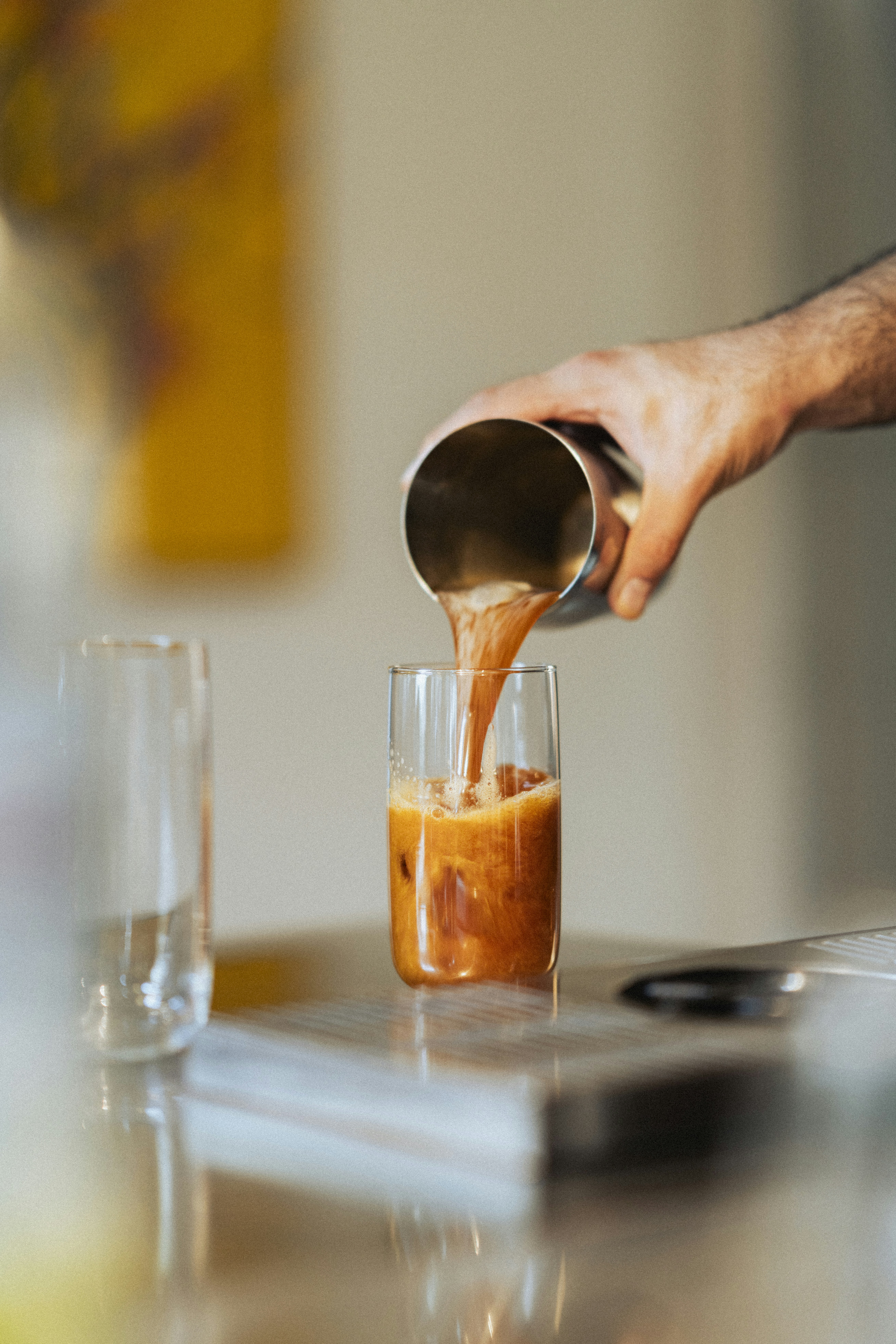 Caramel Cascade: A Precise Pour into a Tall Glass