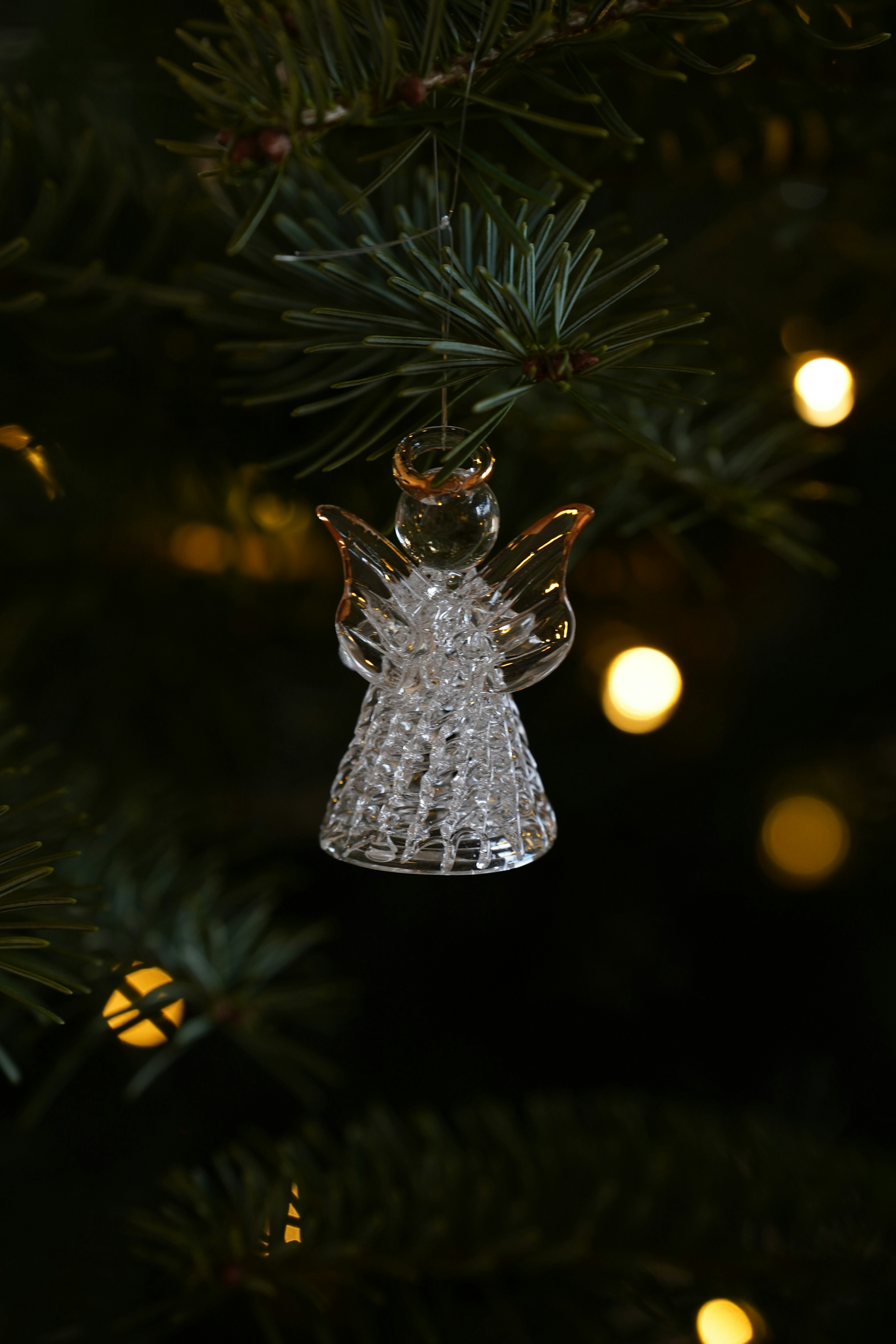 Crystal Angel Ornament Nestles Amid Warm Pine Lights