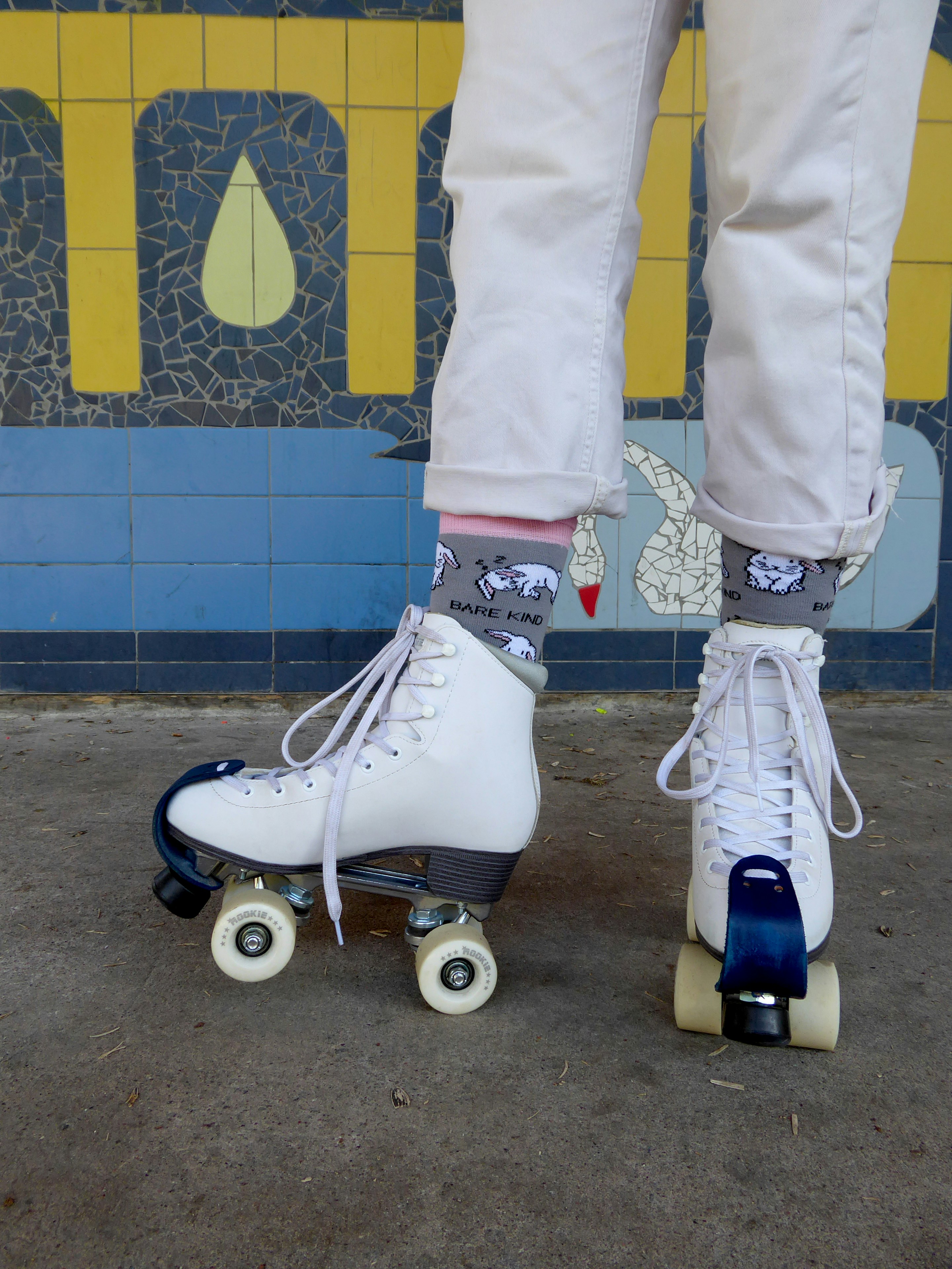 White Roller Boots Grounded Before a Vibrant Mosaic