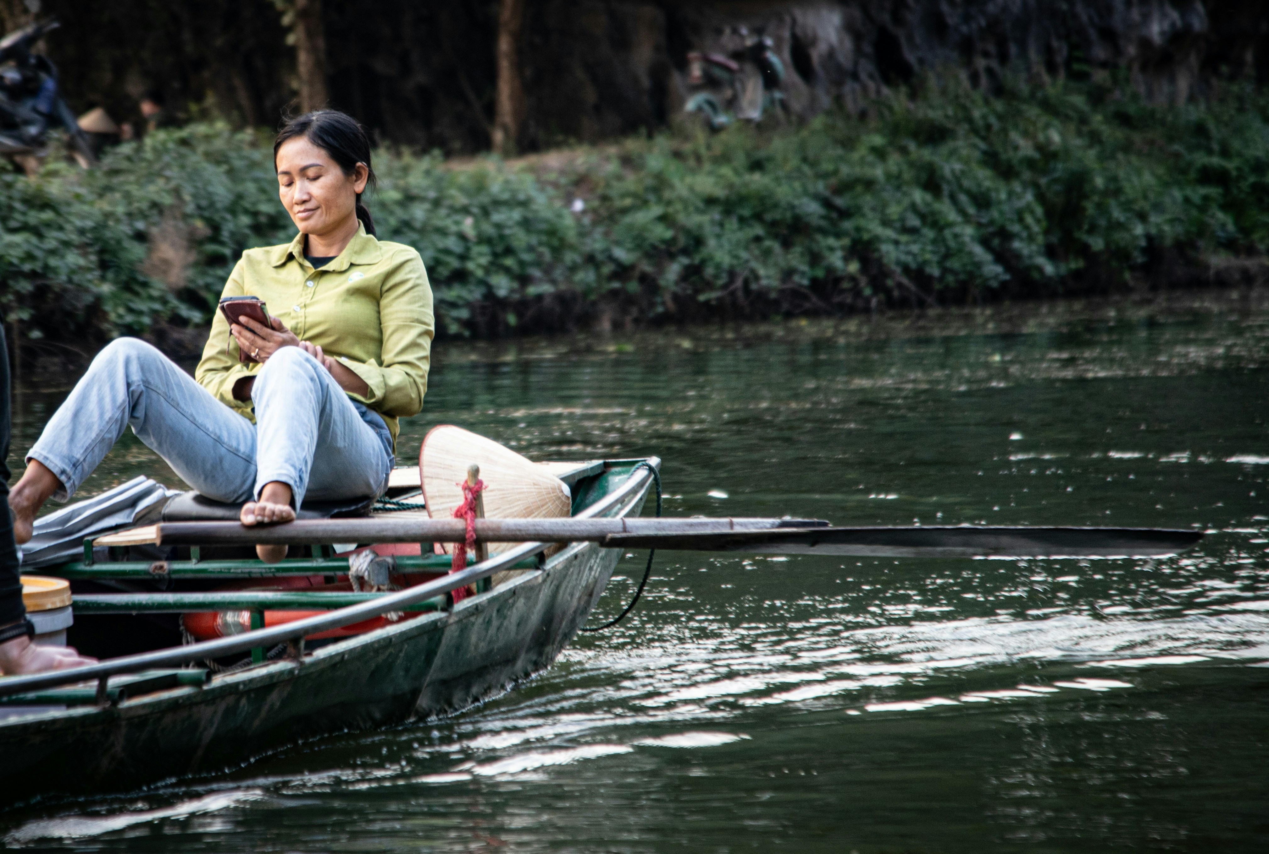 A couple of people riding on top of a boat