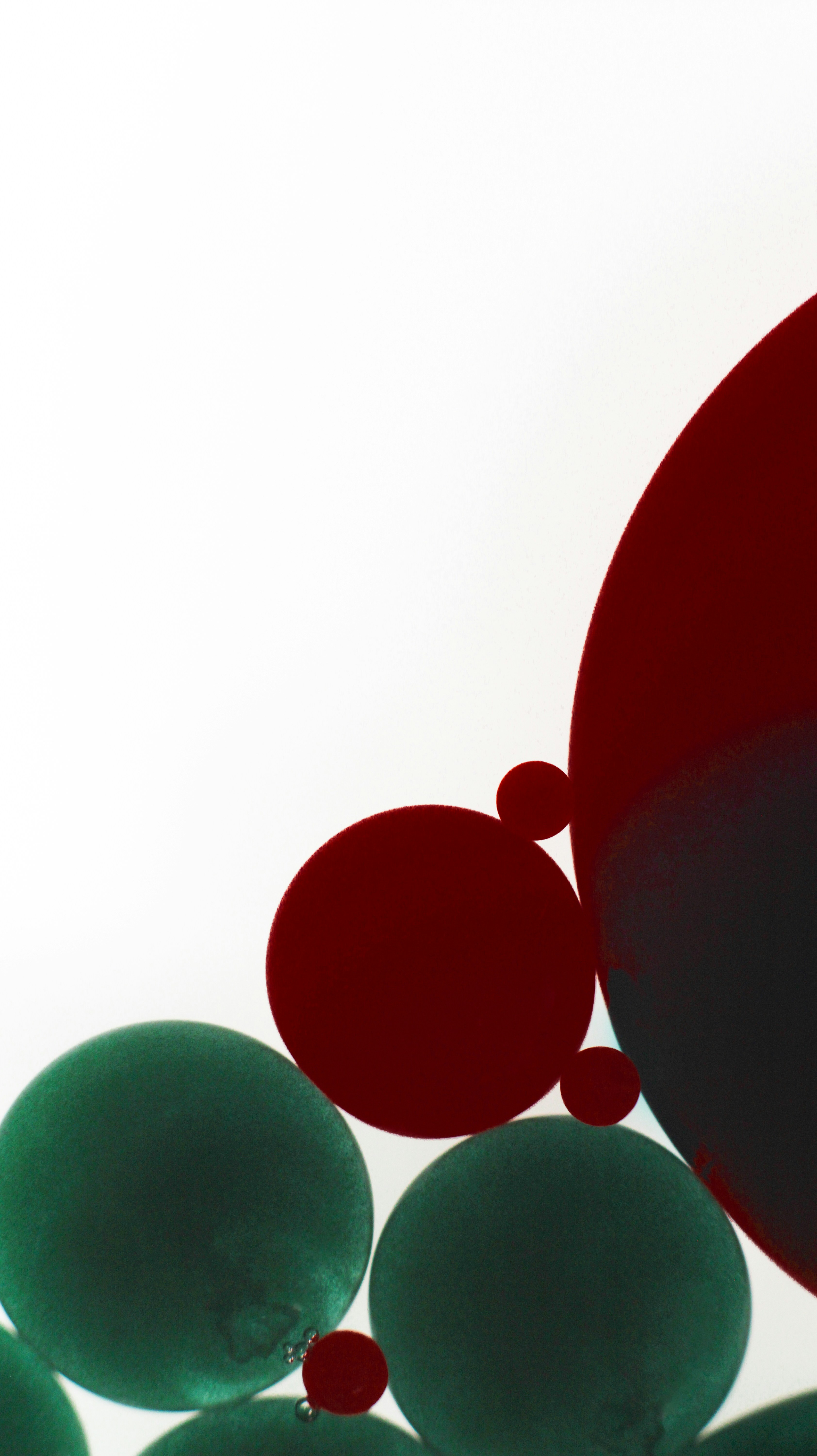A group of red and green balloons floating in the air photo – Free ...