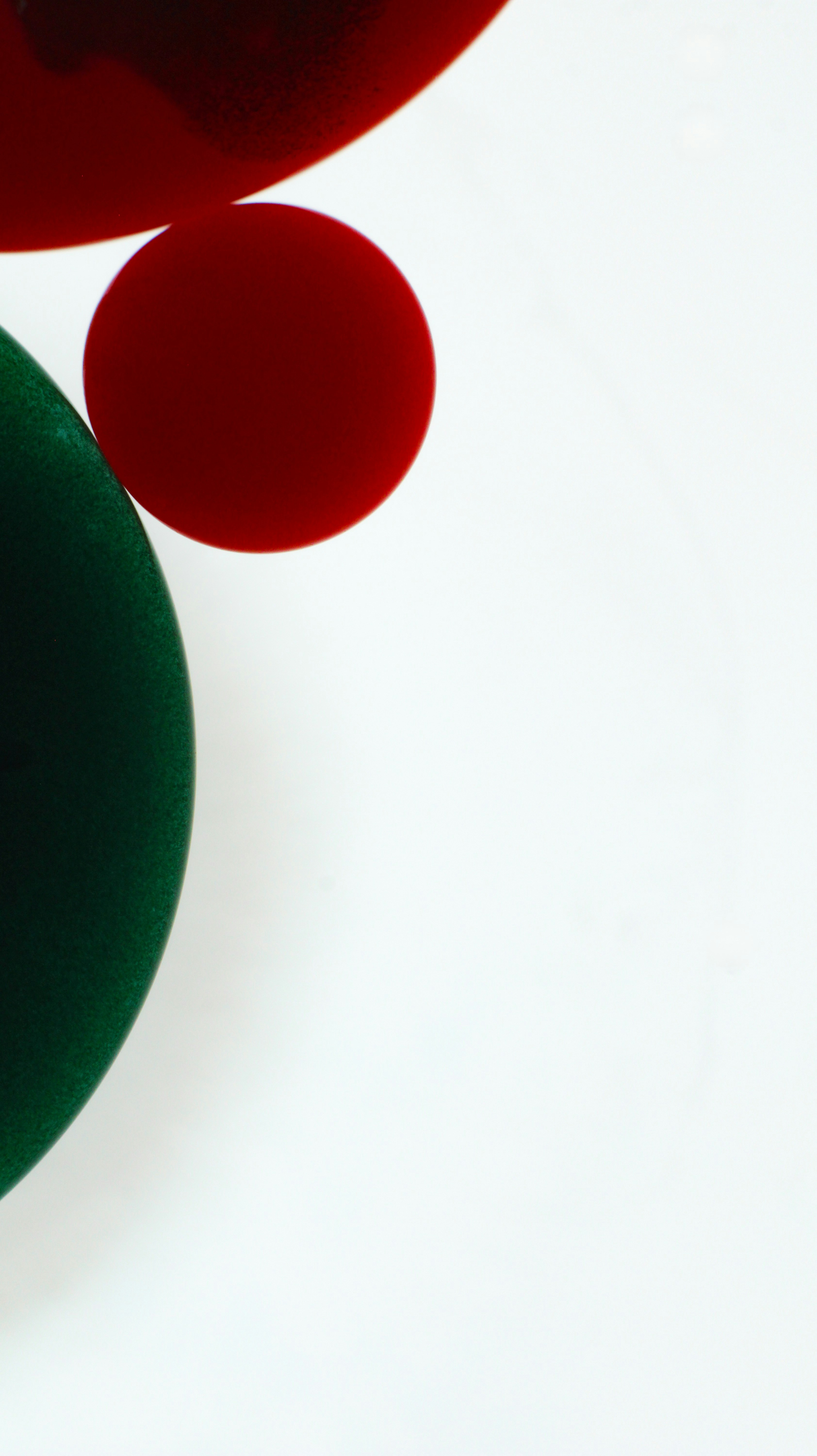 A red and green object on a white surface photo – Free Wallpaper Image ...