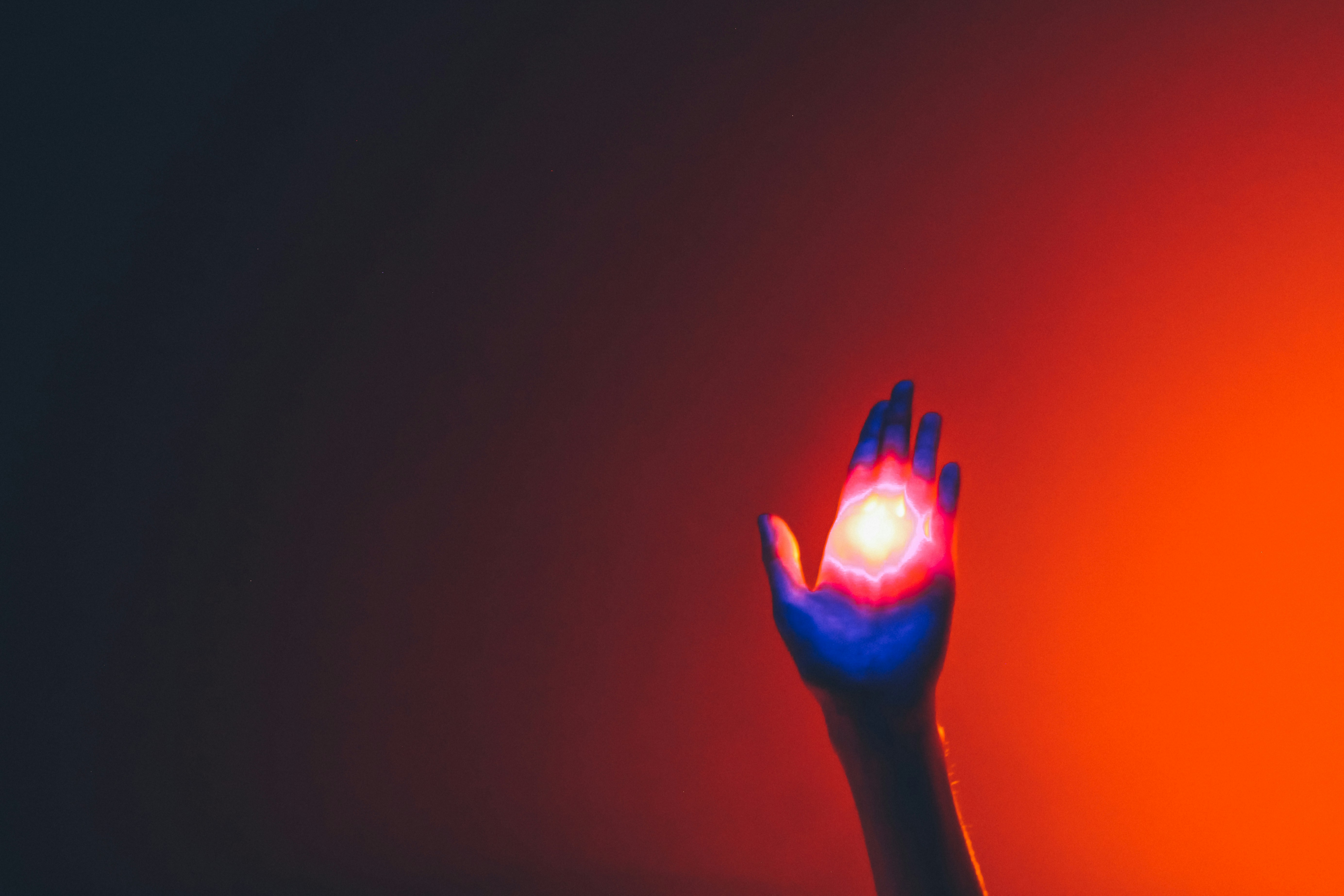 A hand holding a red light in the dark photo – Free Experimental Image ...