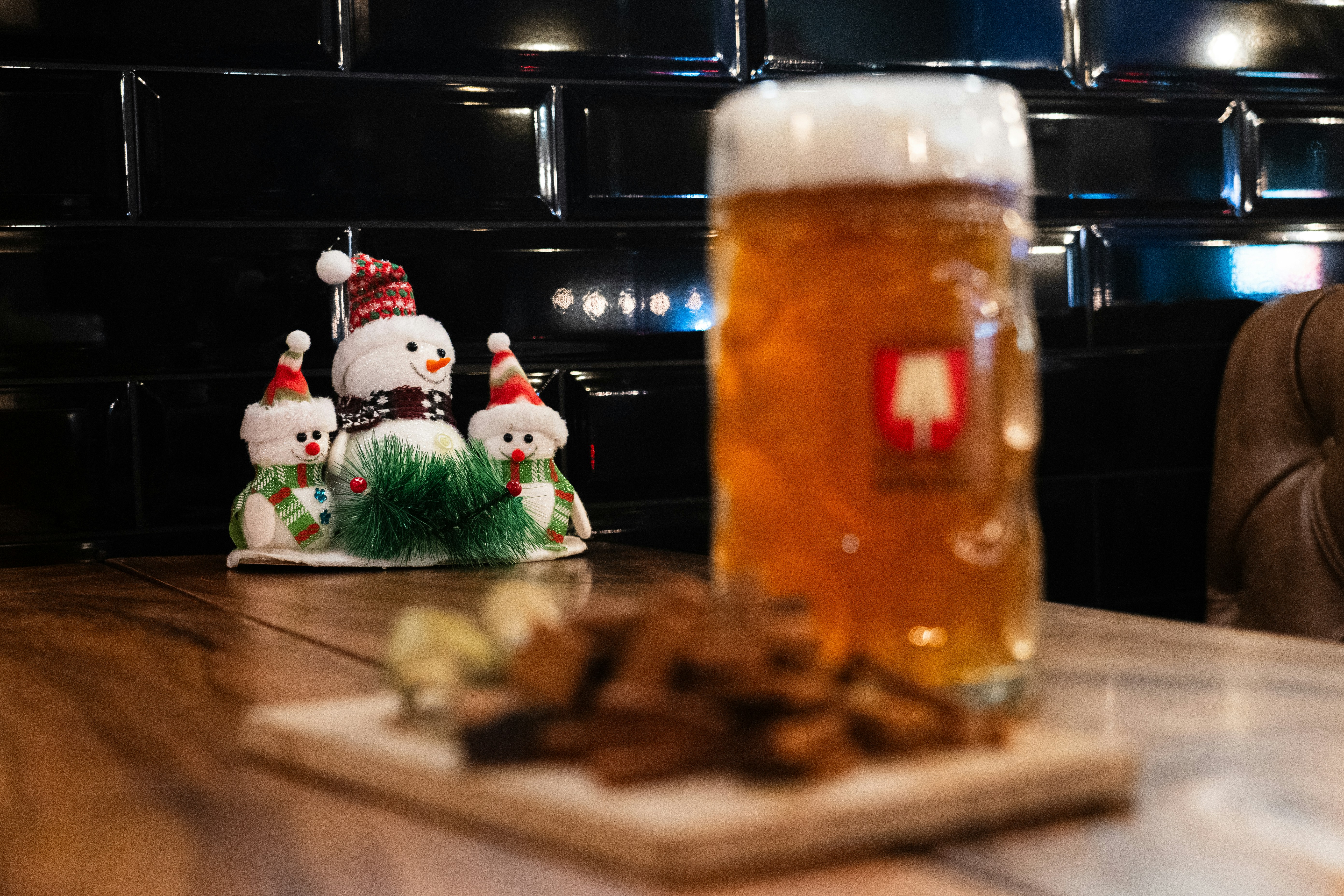 Amber Pint and Snowmen: A Cozy Holiday Bar Top Portrait