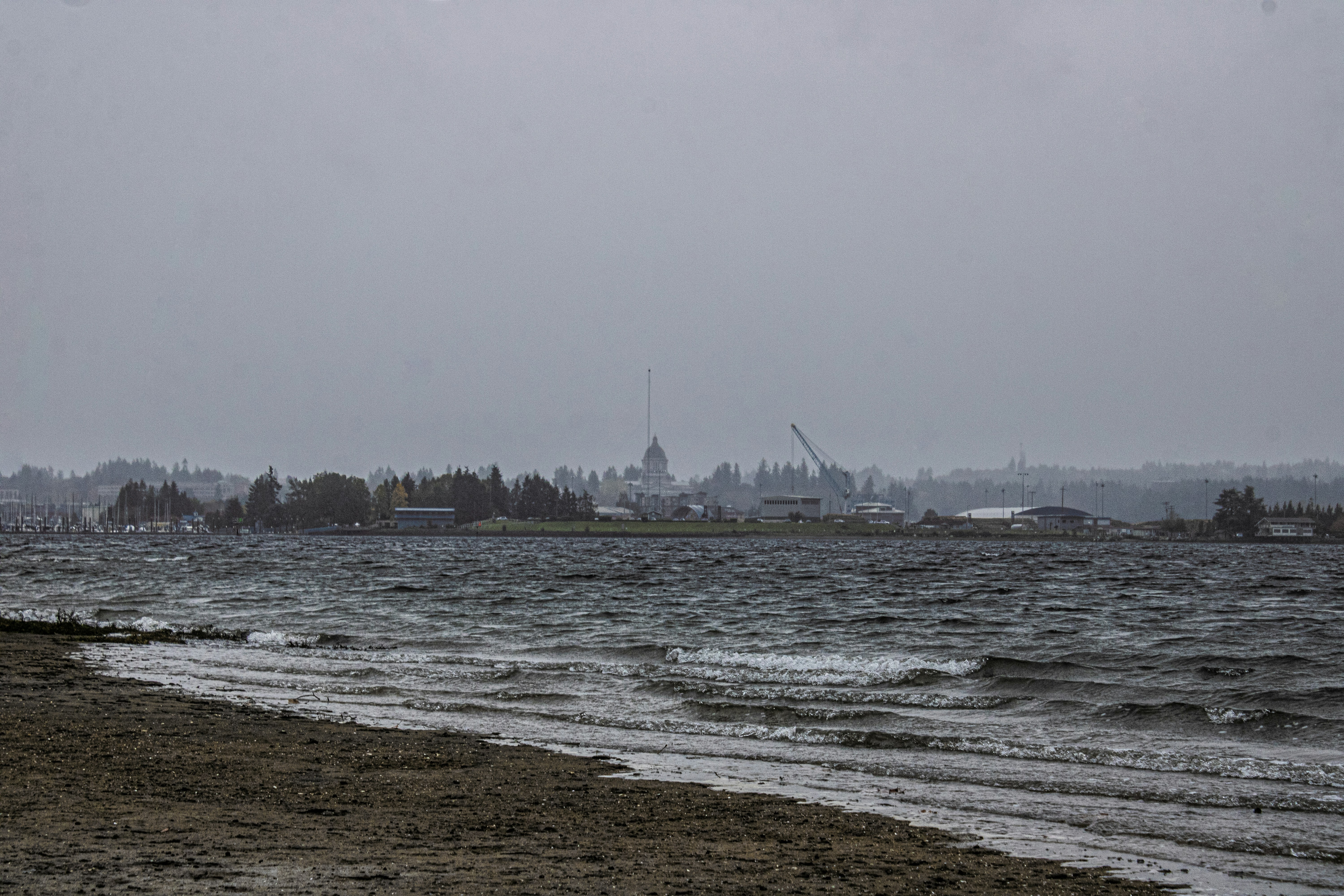 Misty Seascape: Distant Skyline Emerges Through a Leaden Morning