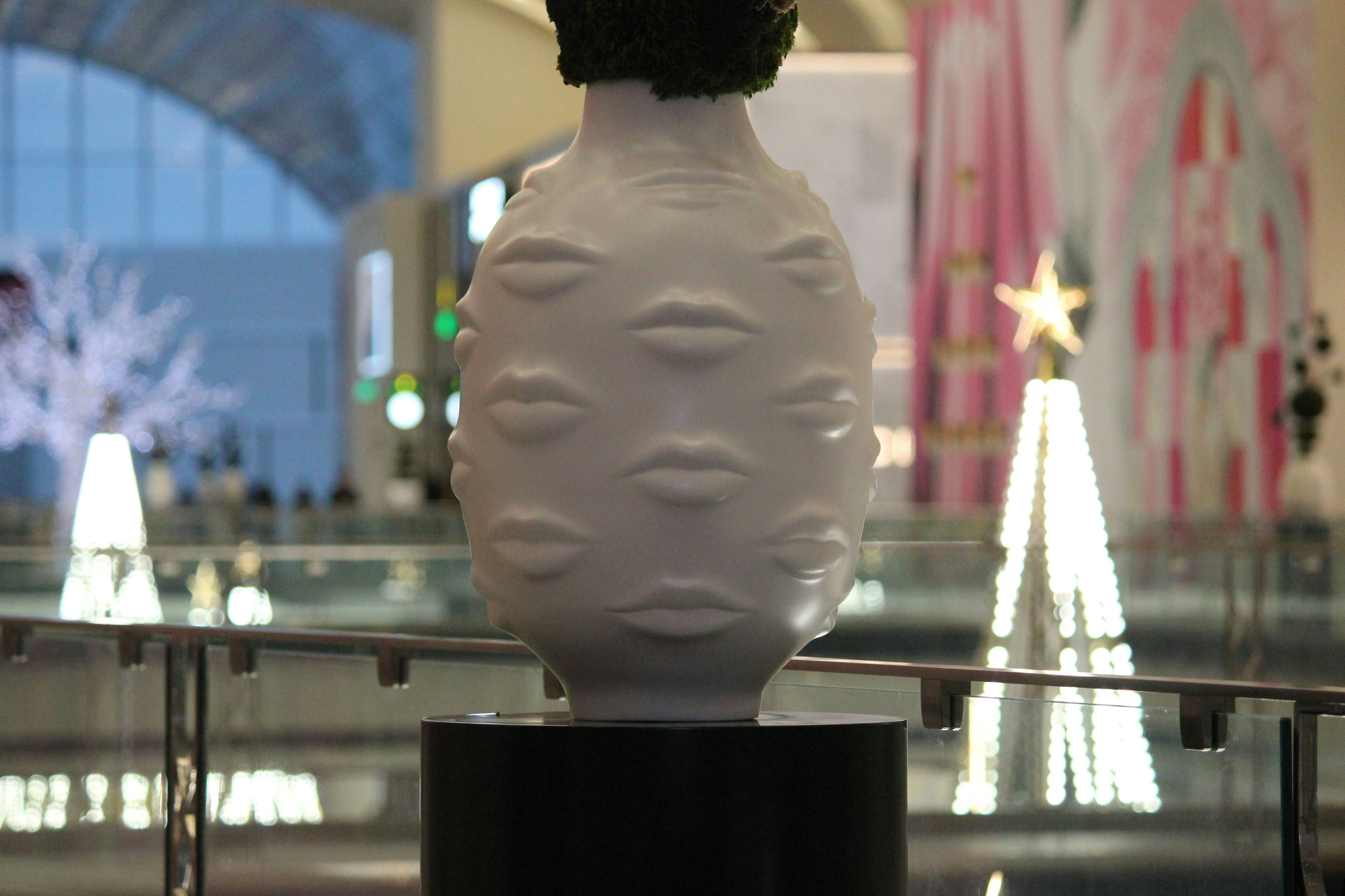 Lip-Textured Vessel in a Glass Atrium: A Quiet Study of Light