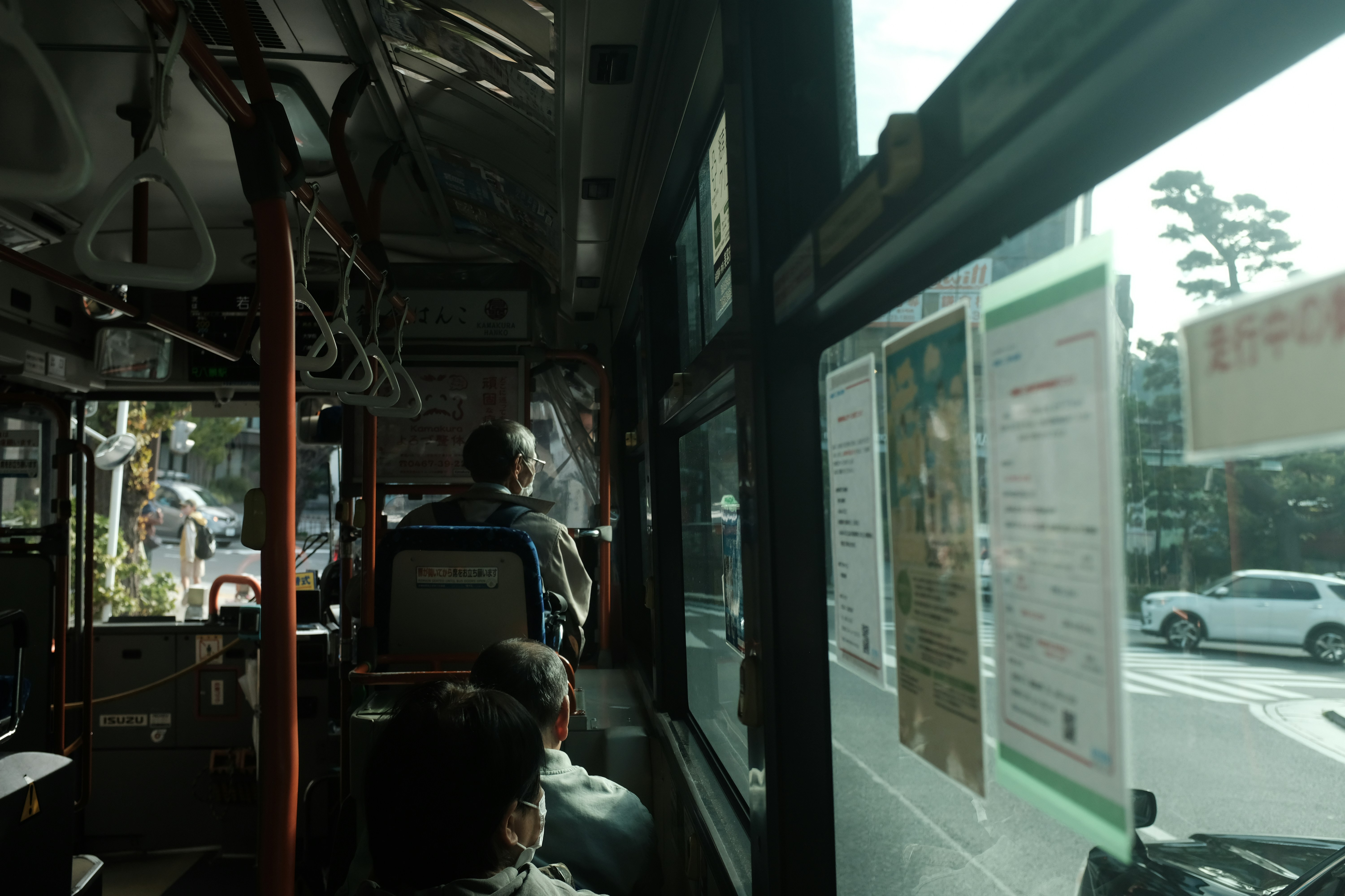 A bus filled with lots of people sitting next to each other photo ...