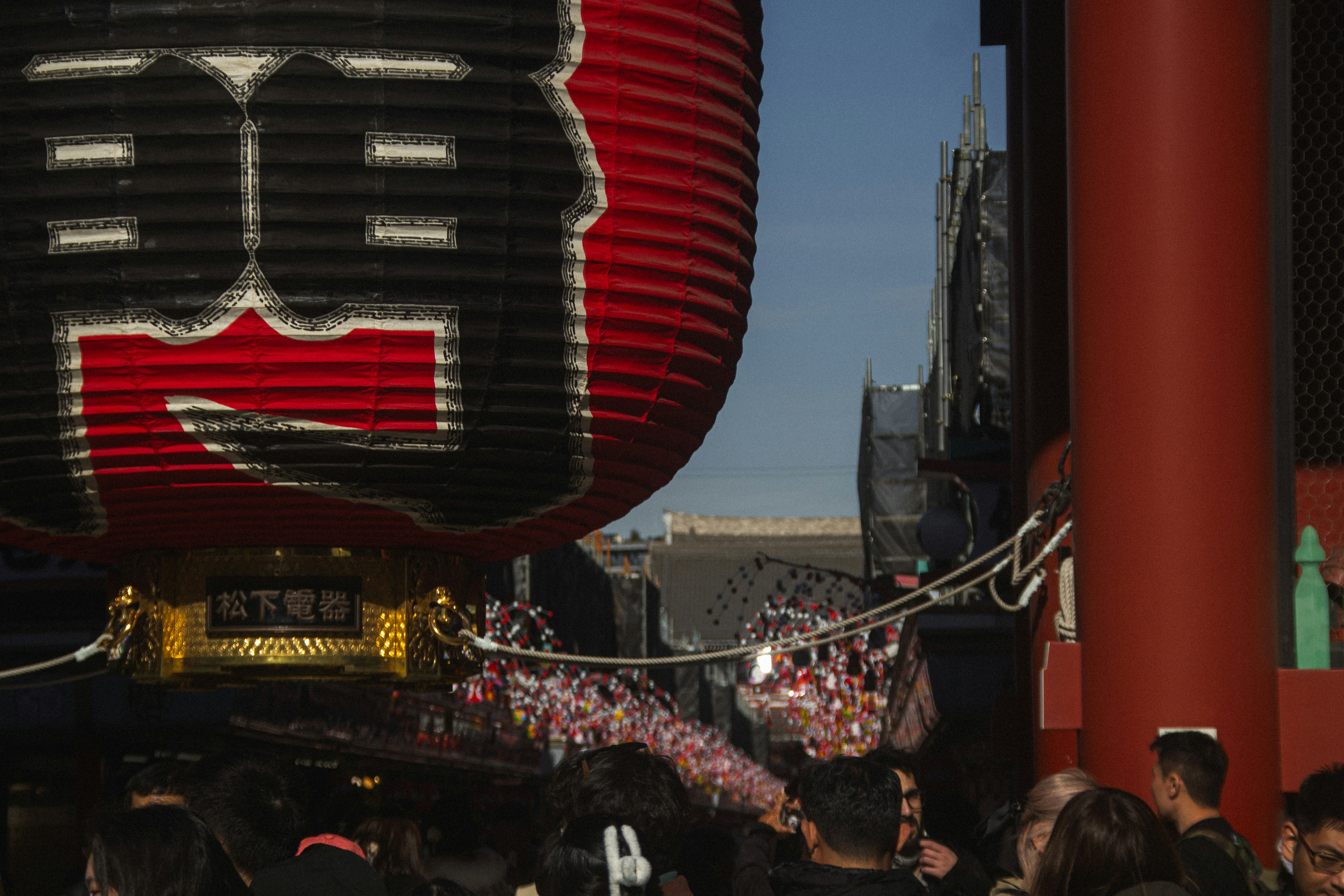 Crimson Lantern Looms Over a Sea of Festival Goers at the Shrine Gate