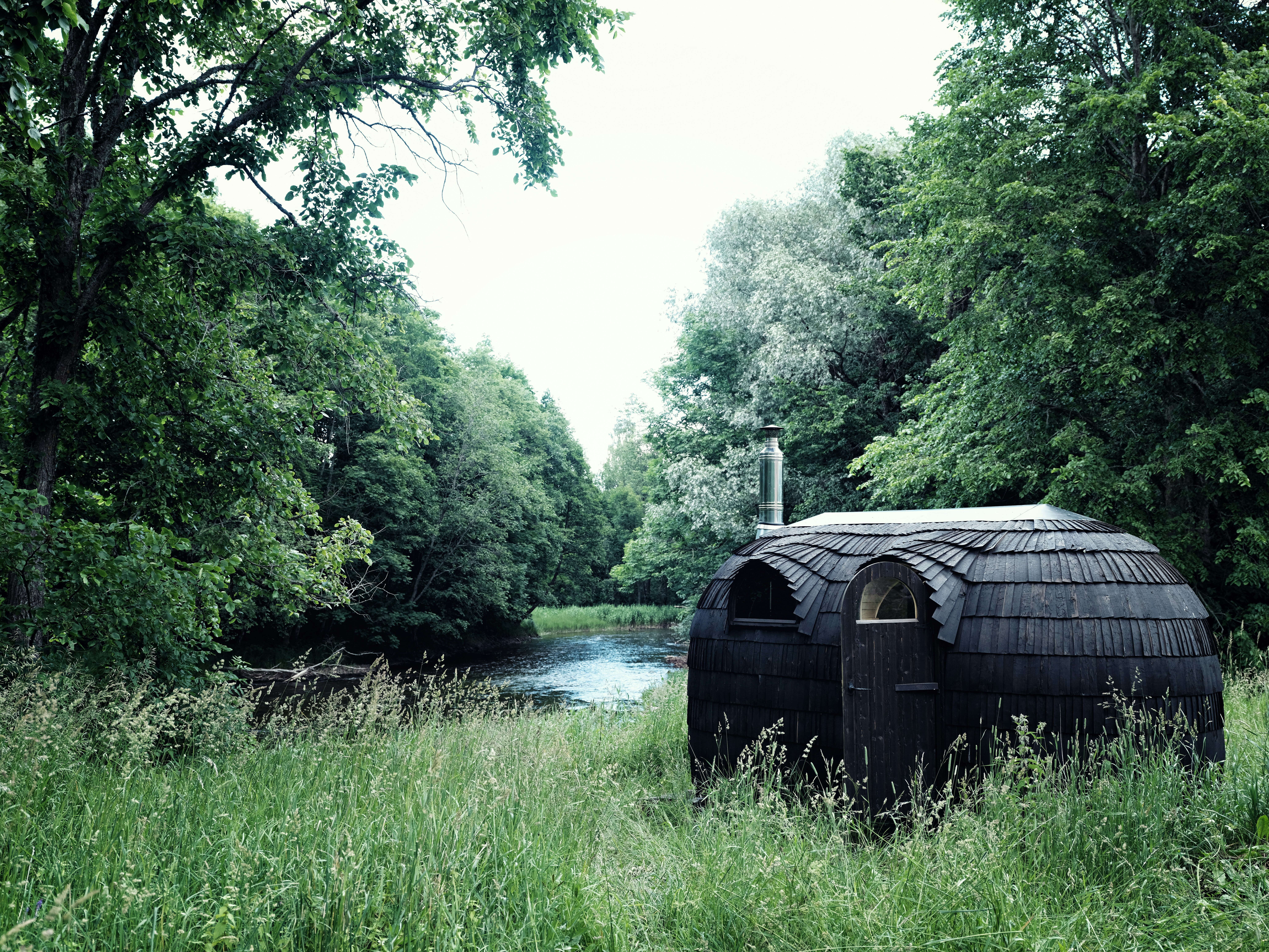 A Quiet River Home: The Dome Boat by the Weeping Willows