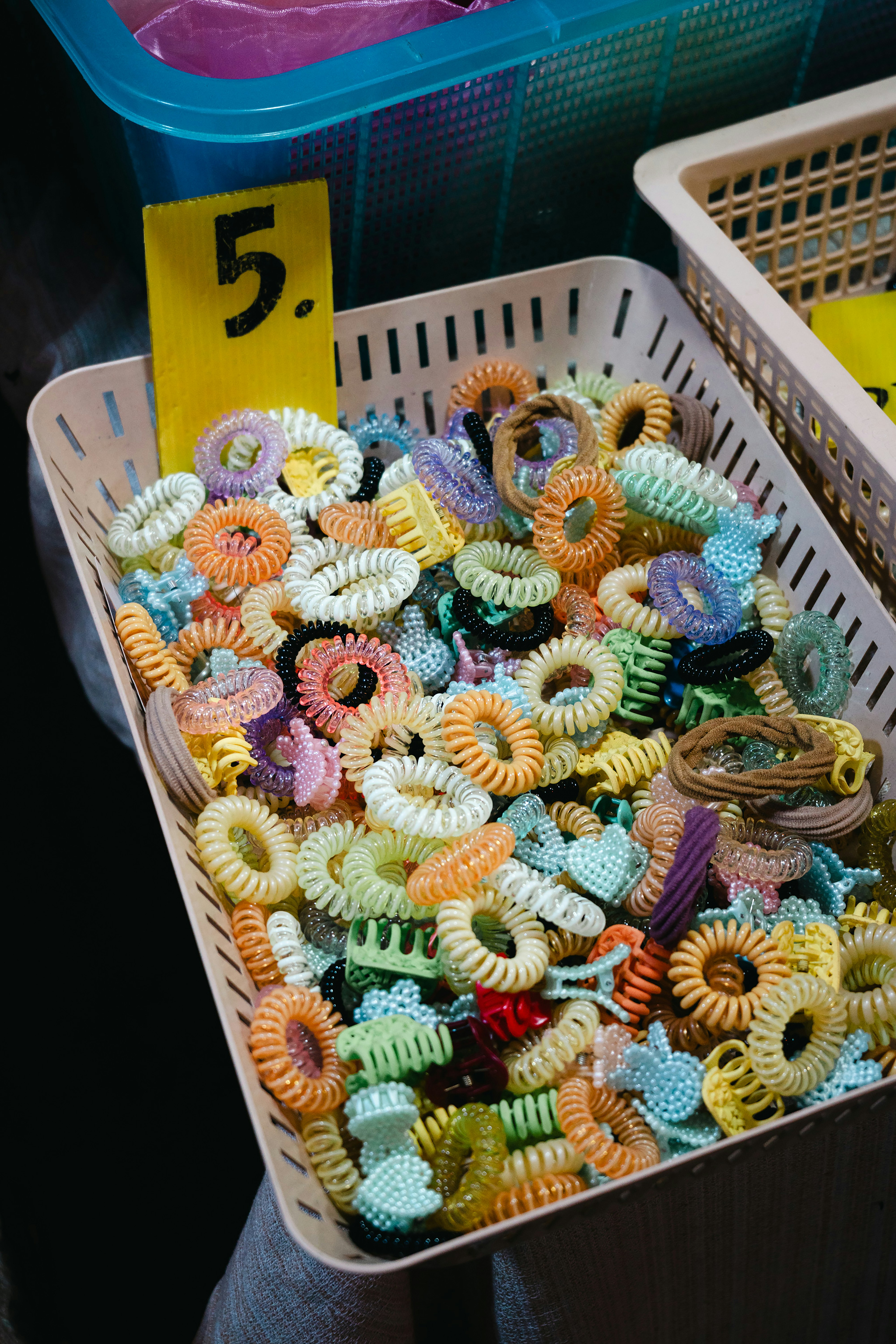 A basket filled with lots of different colored hair clips photo – Free ...