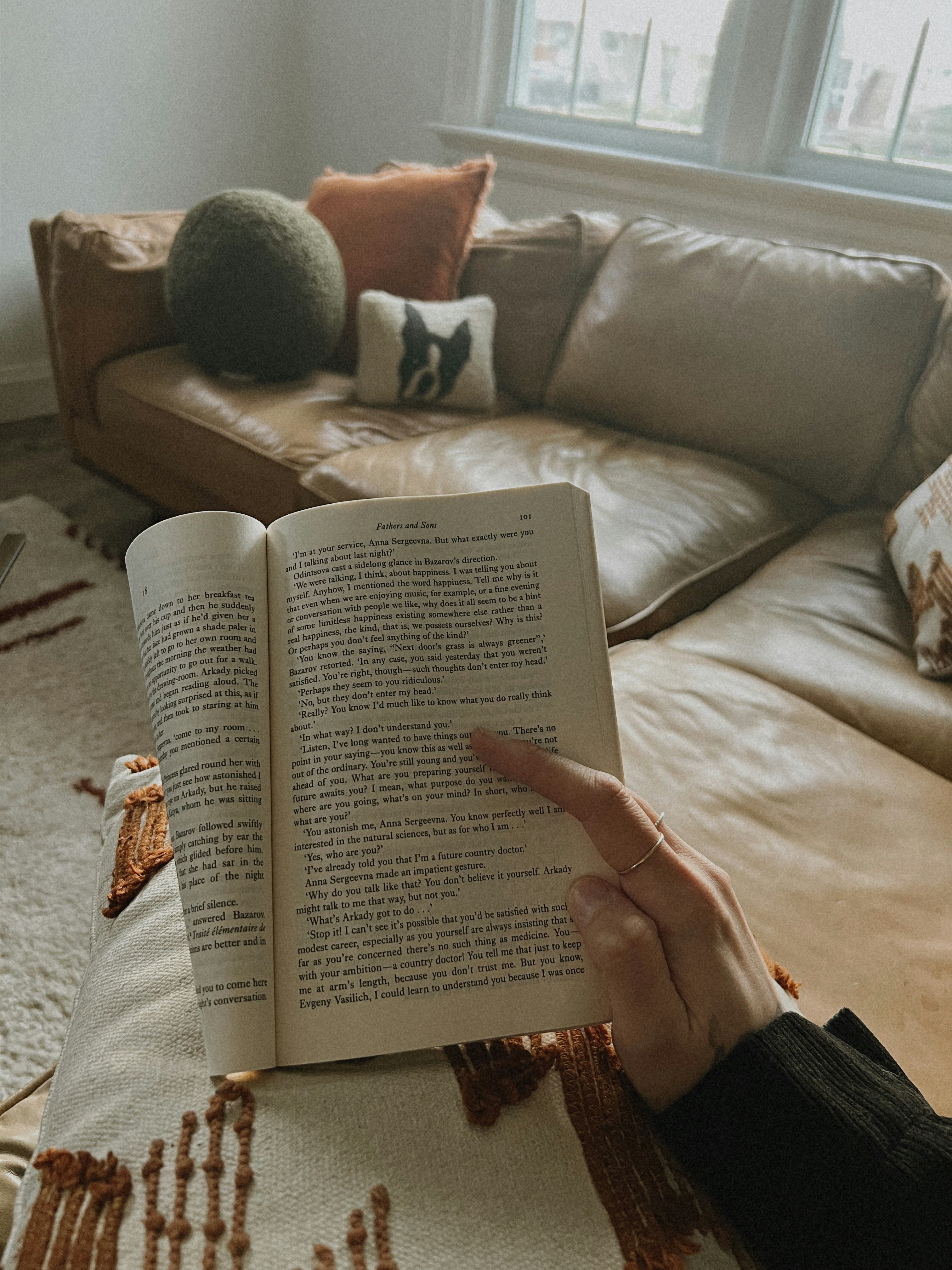 A person is reading a book on a couch photo – Free Book Image on Unsplash