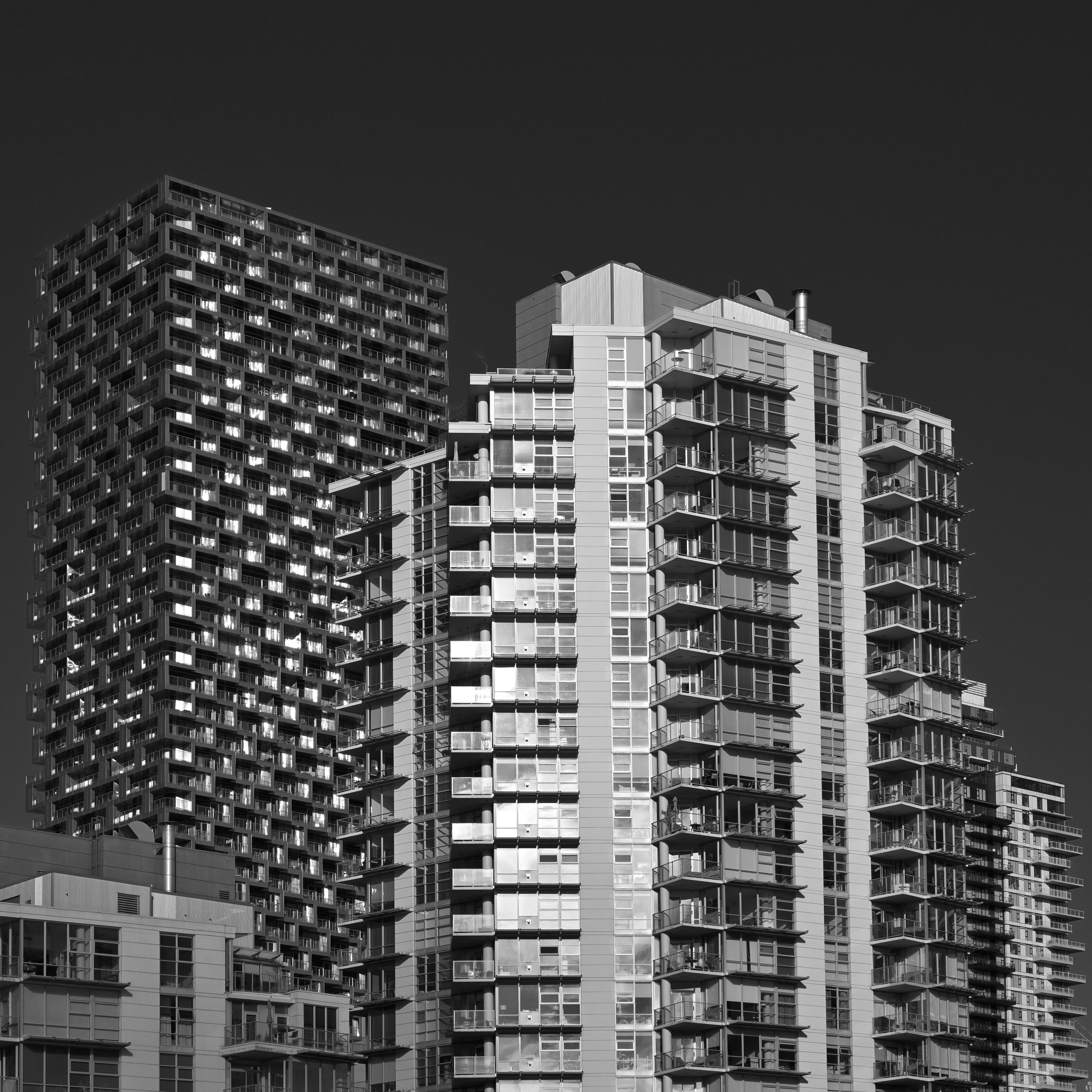 Urban Monoliths: A Night-Worn Facade of Concrete Heights