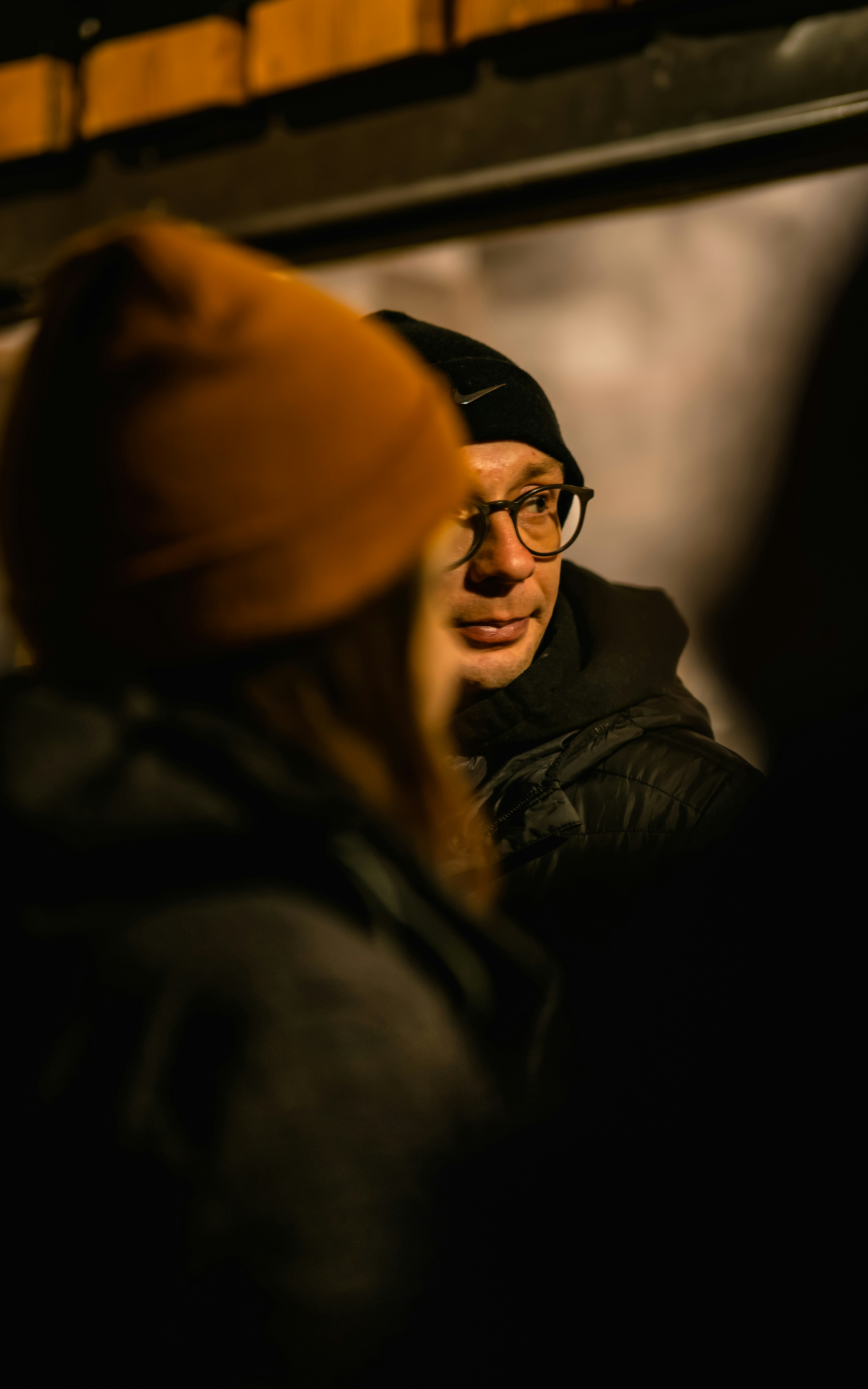 Conversation in the Night: A Gloved Figure in Focus