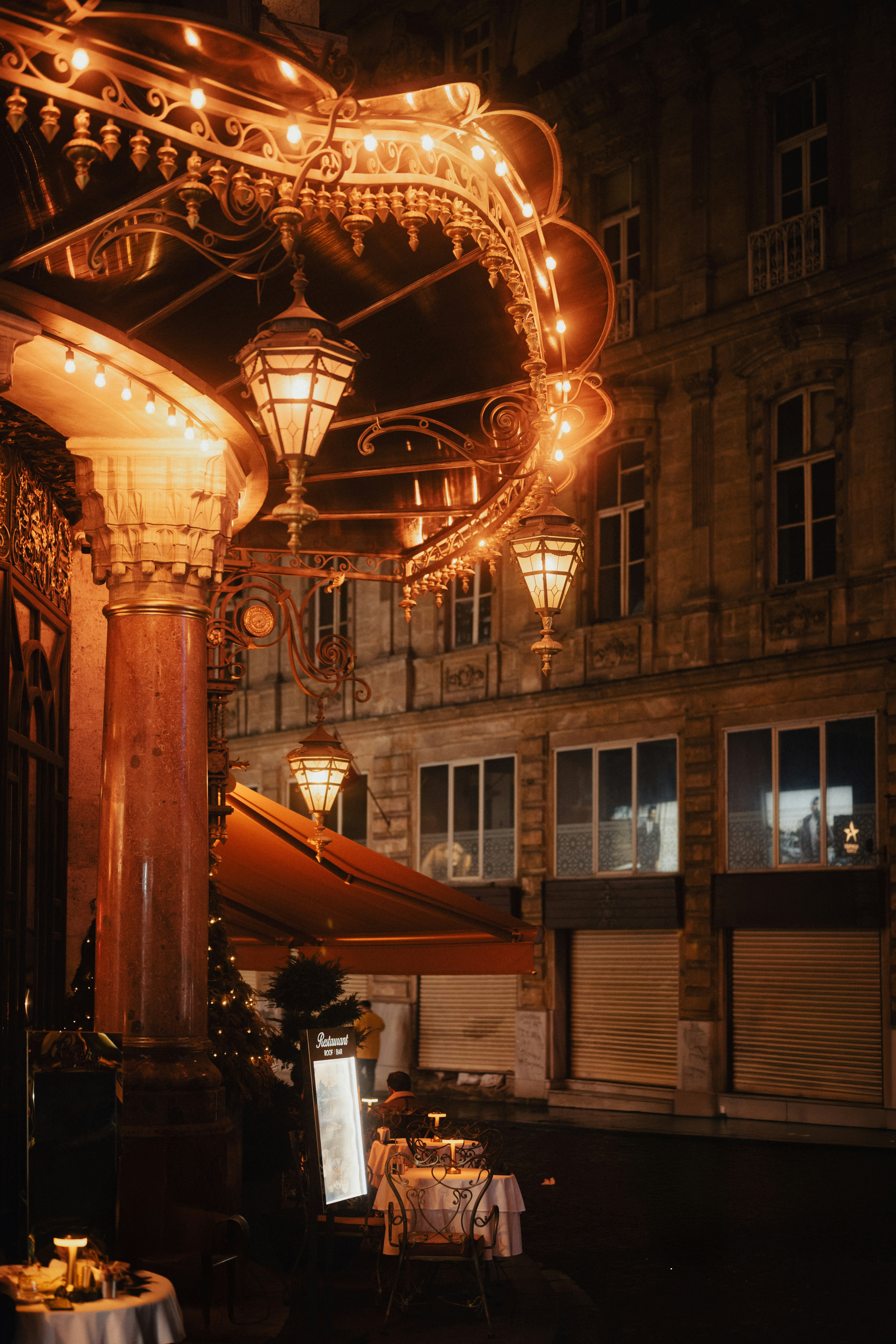 Amber Lanterns Over a Quiet Night Cafe