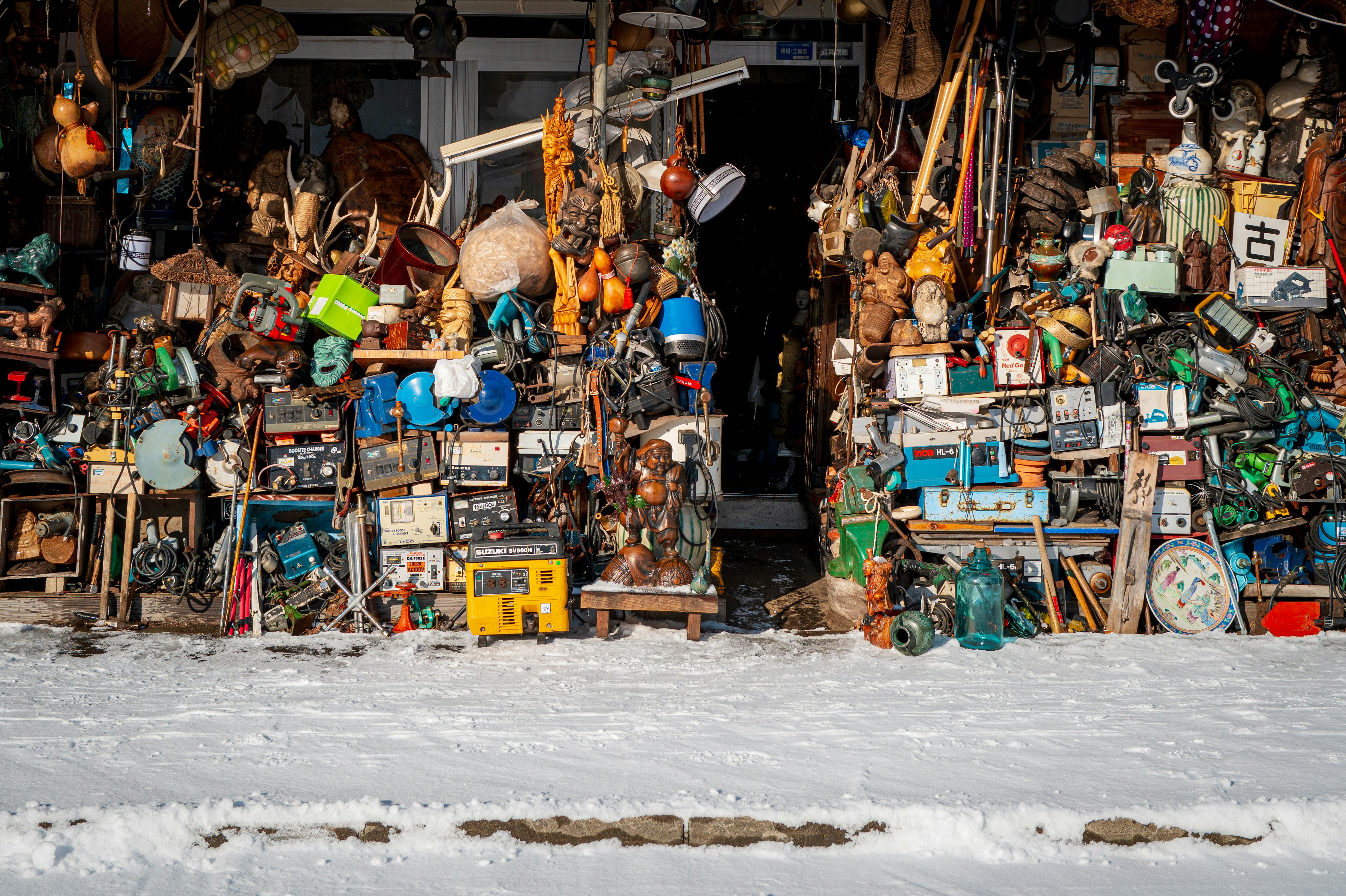 A store with a lot of stuff on the front of it