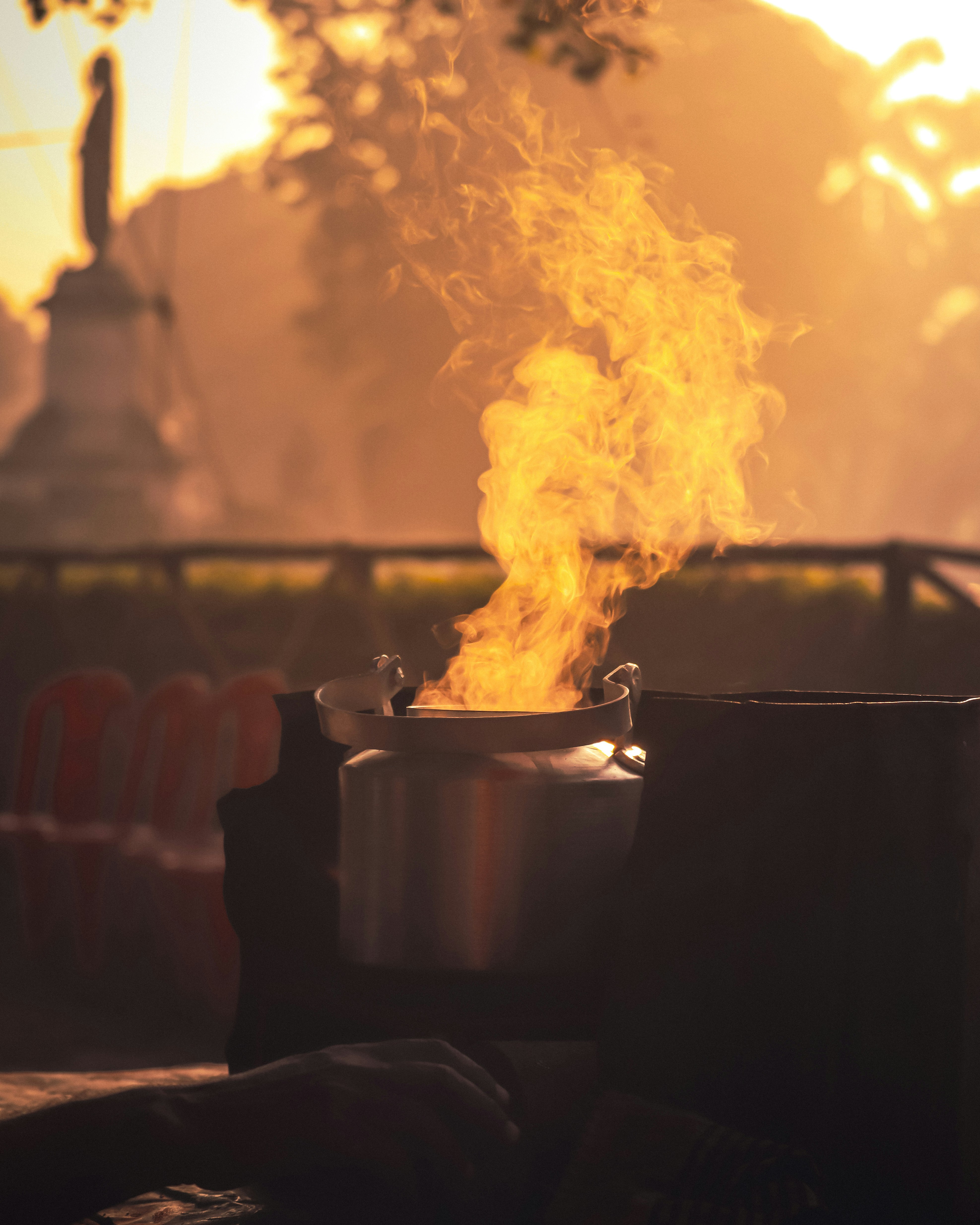 Steam Rising from a Stovetop Kettle against a Golden Sunset