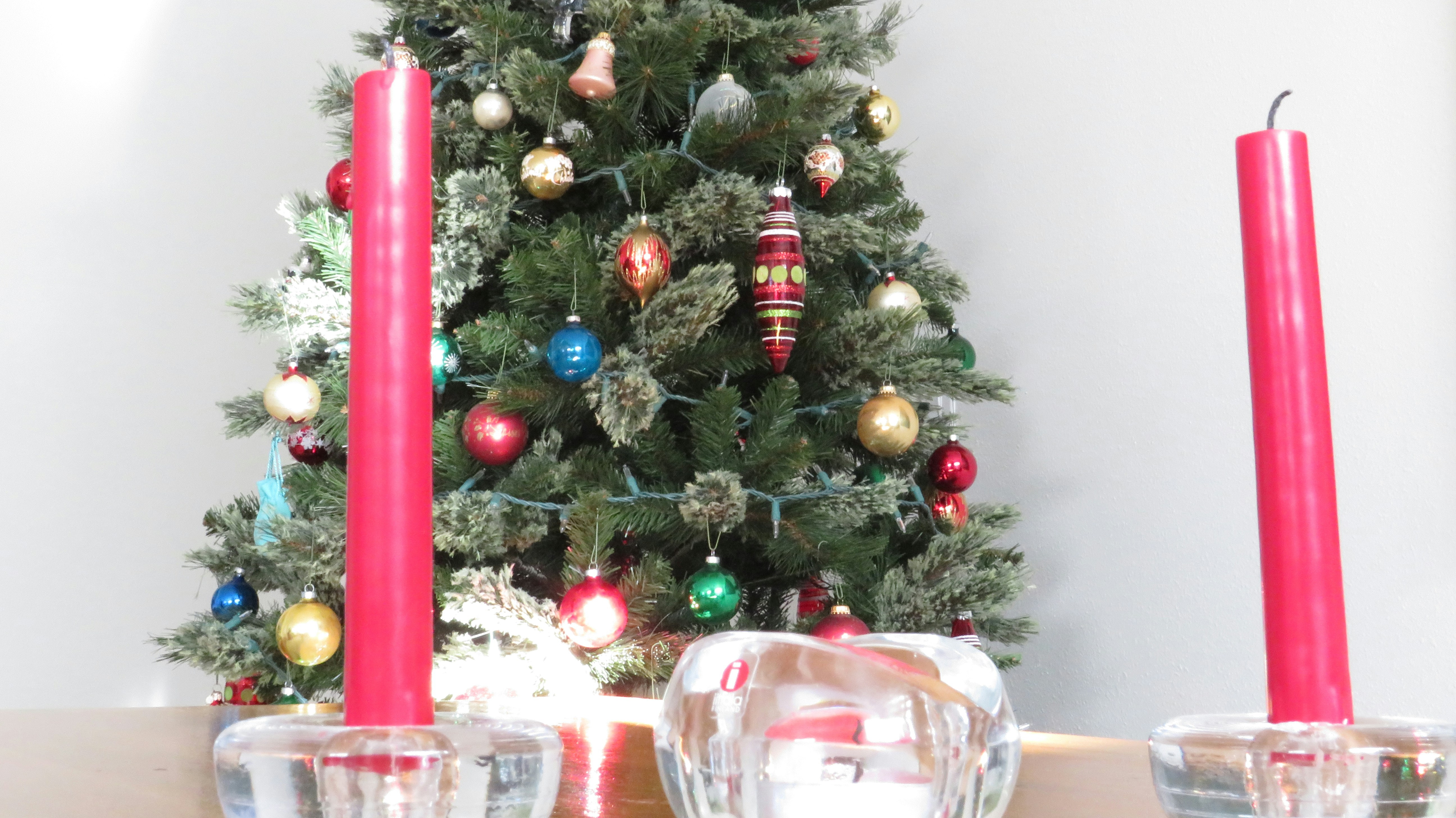 Crimson Candles Guard a Festive Christmas Tree